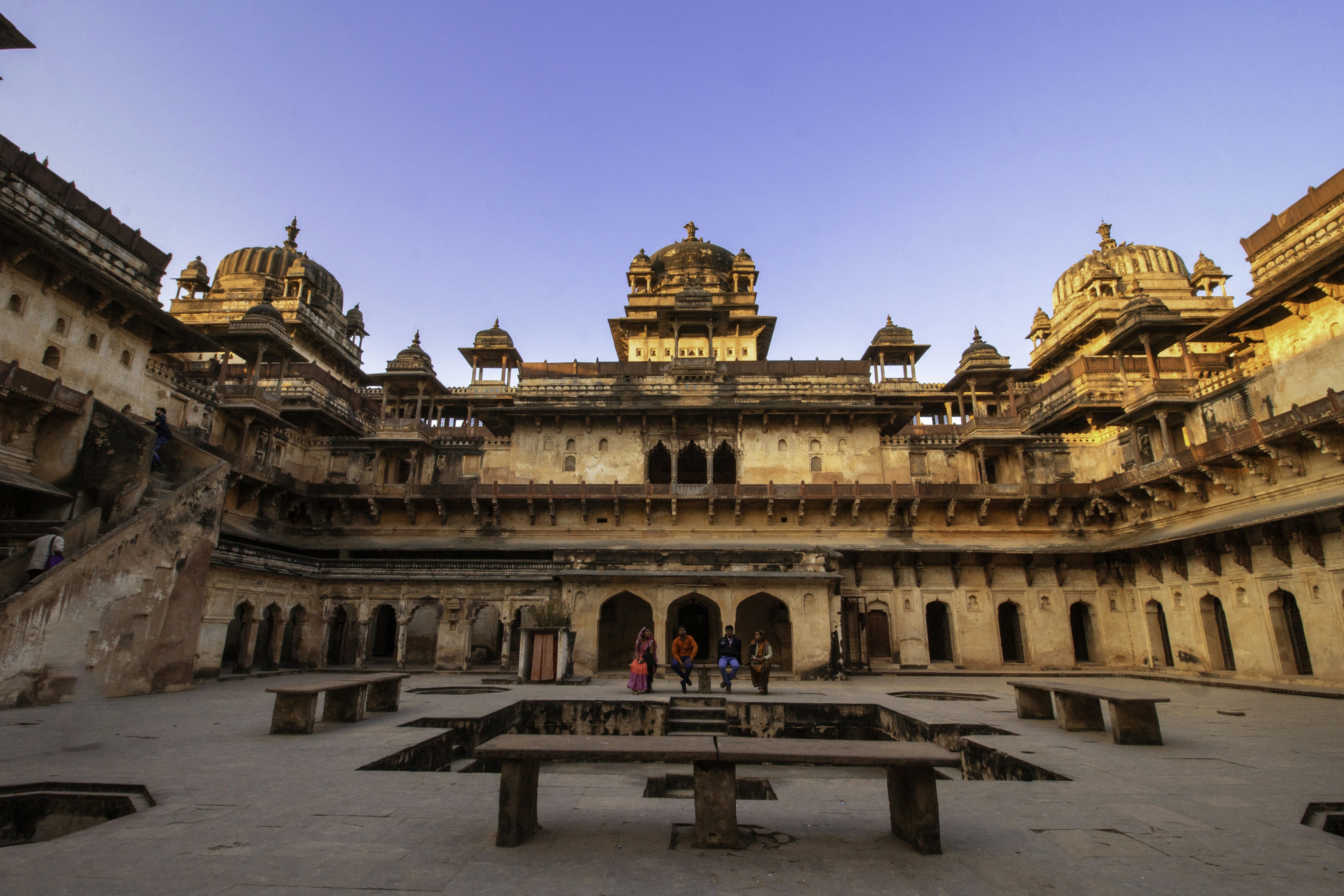 Historic palace courtyard under a clear evening sky.
