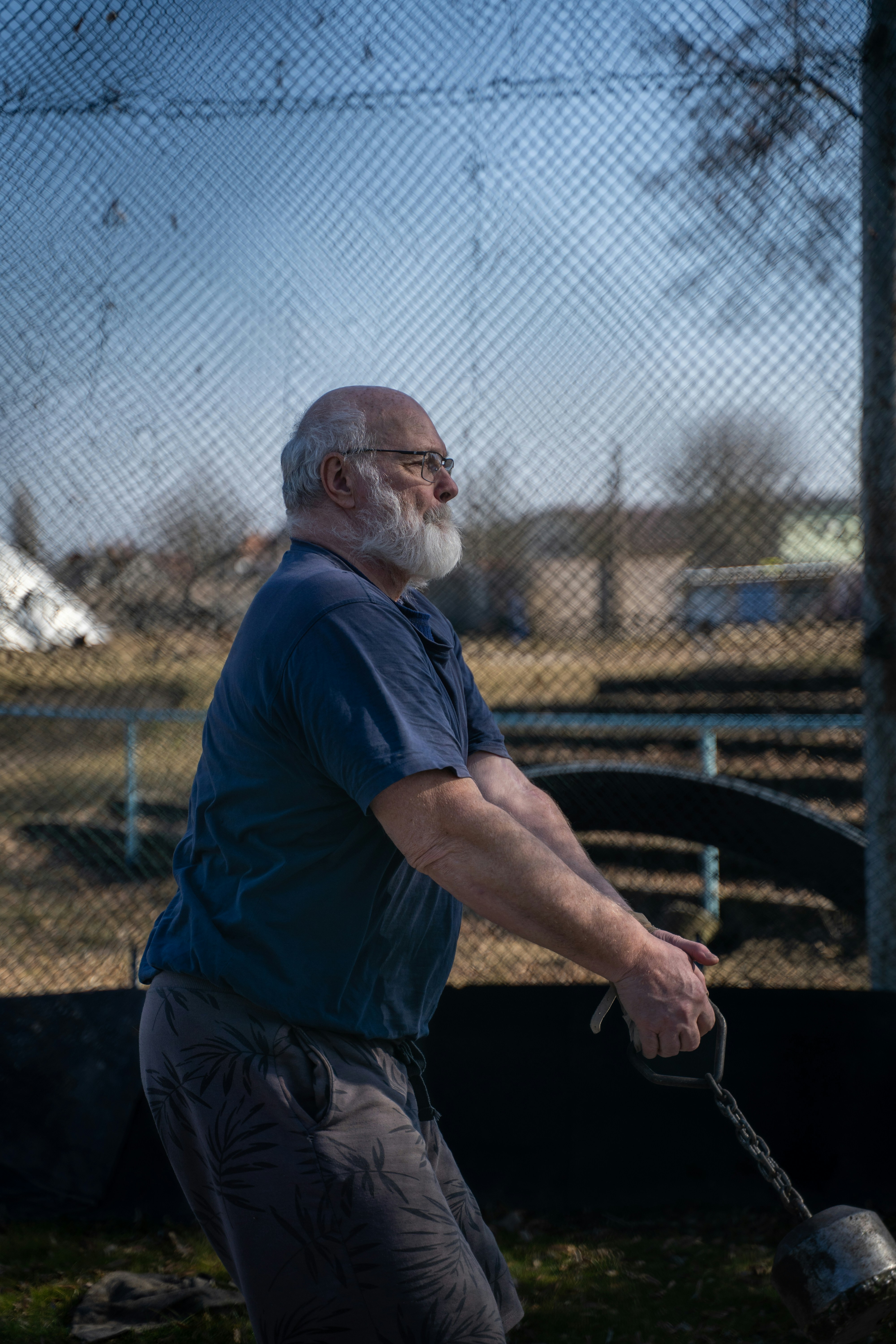 Grip and Grit at the Fence: A Quiet Portrait of Determination