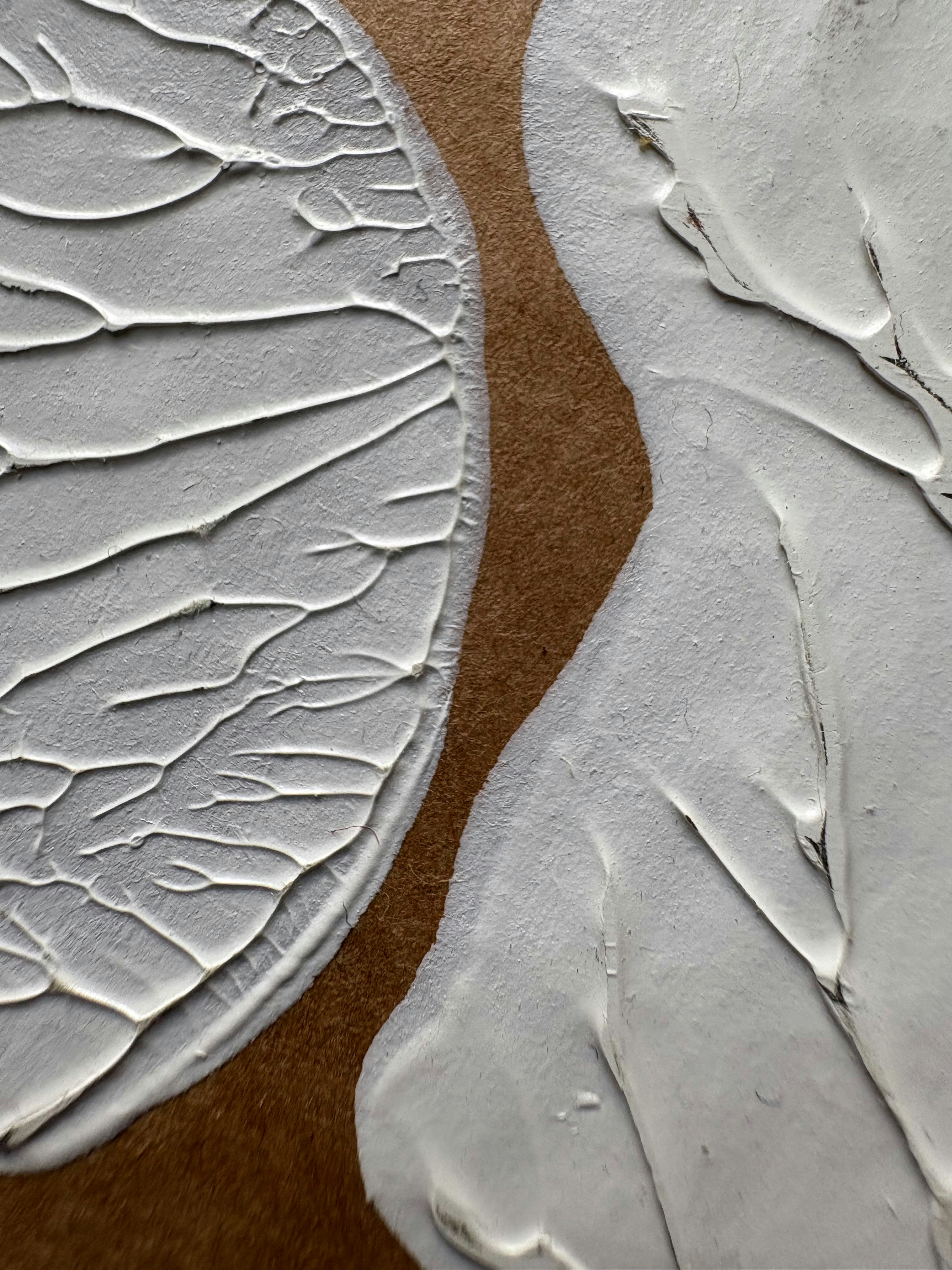 Intricate white textures contrast against a warm brown background, showcasing the interplay of materials and light.