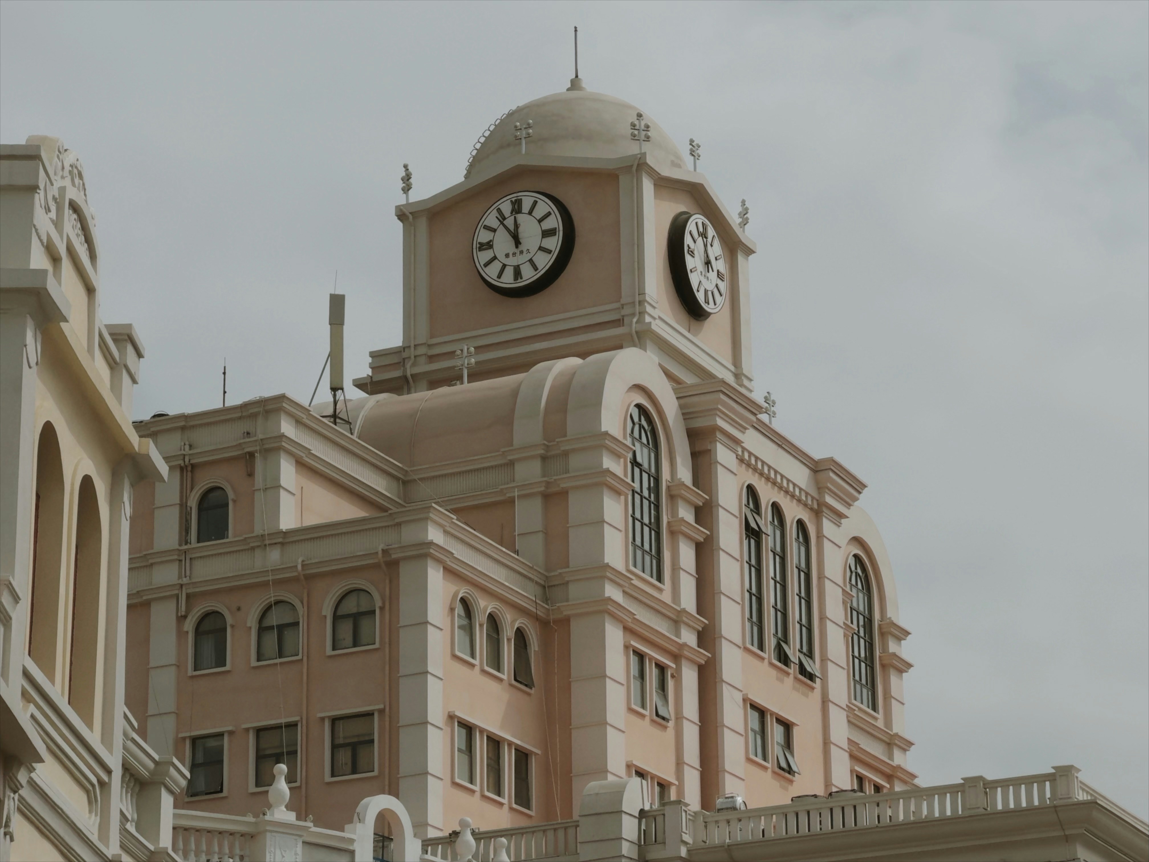 A building with a clock tower stands tall. photo – Free Building Image ...