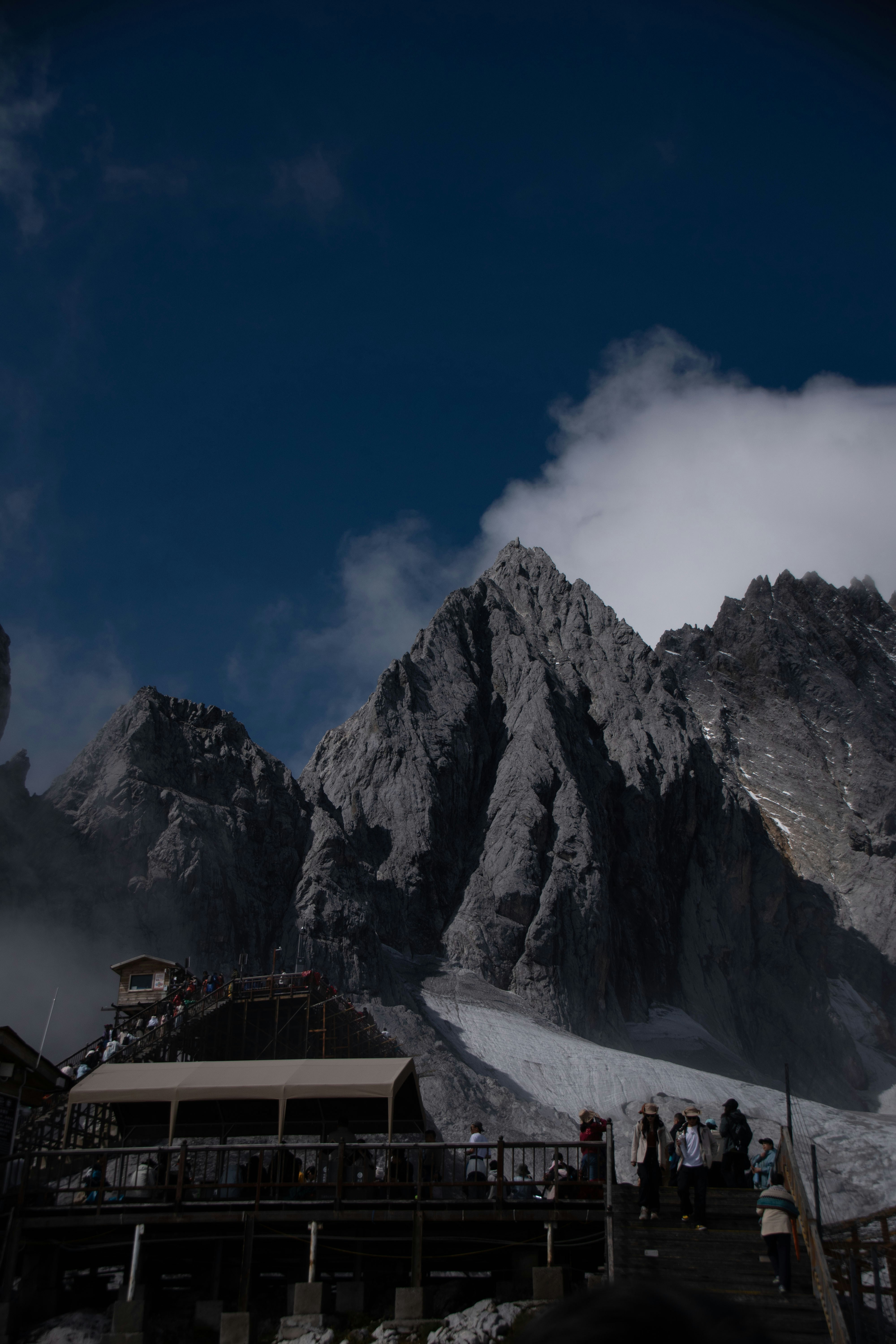 Spectacular mountain range under a cloudy blue sky. photo – Free Human ...