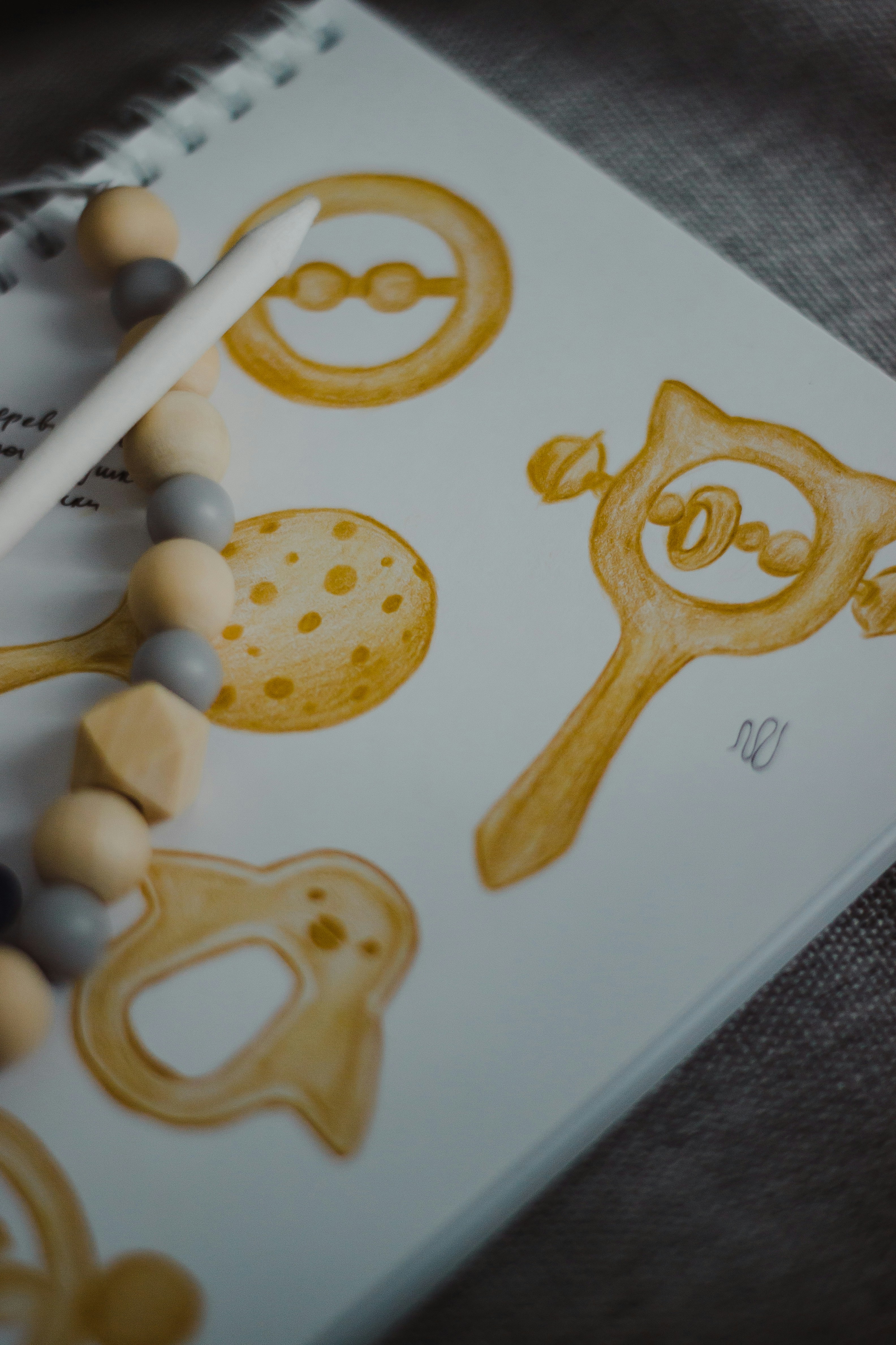 Beads and Sketch: A Quiet Studio Moment on Orange Lines