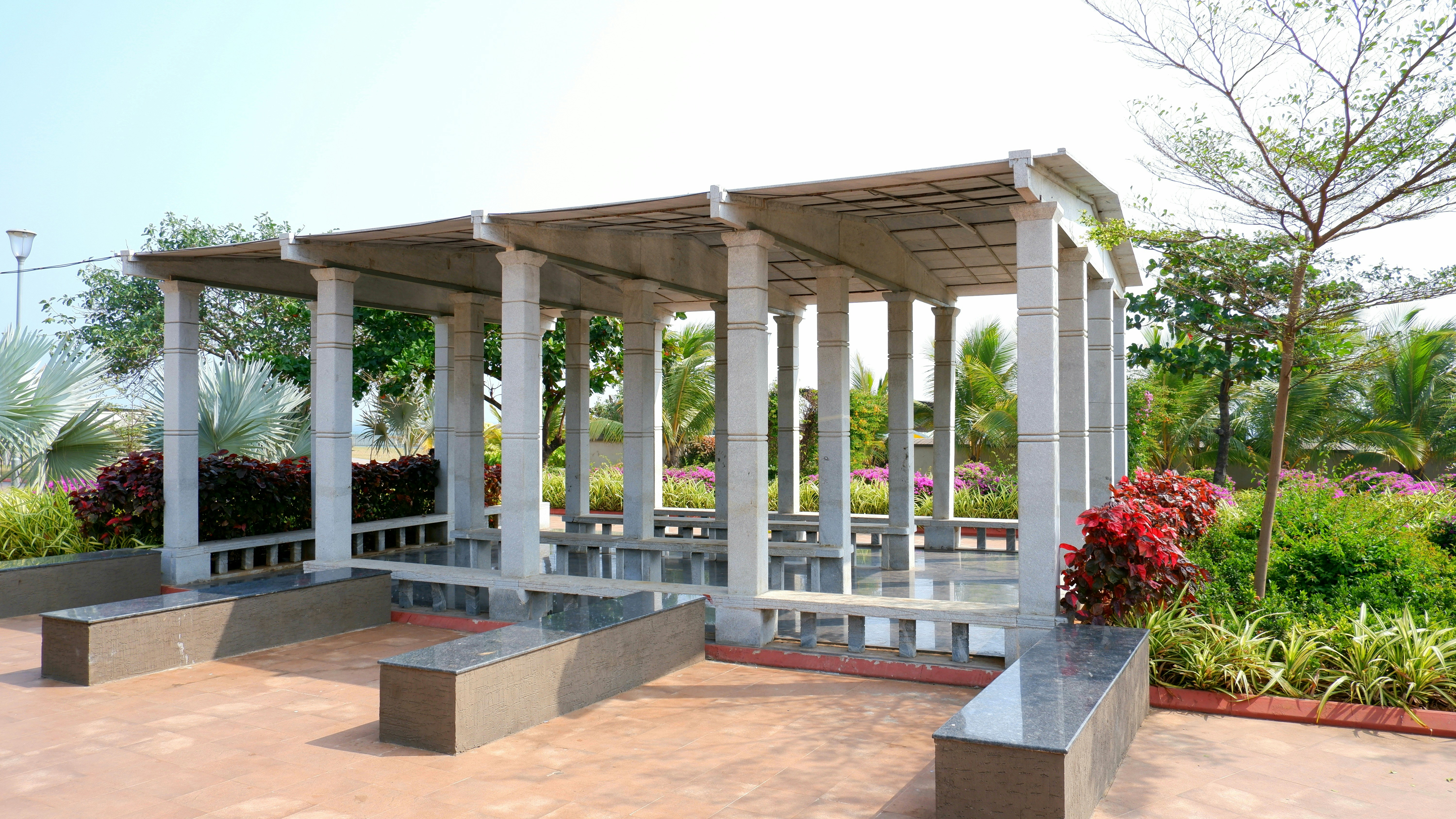 A pavilion with benches stands in a park. photo – Free Outdoor Image on ...