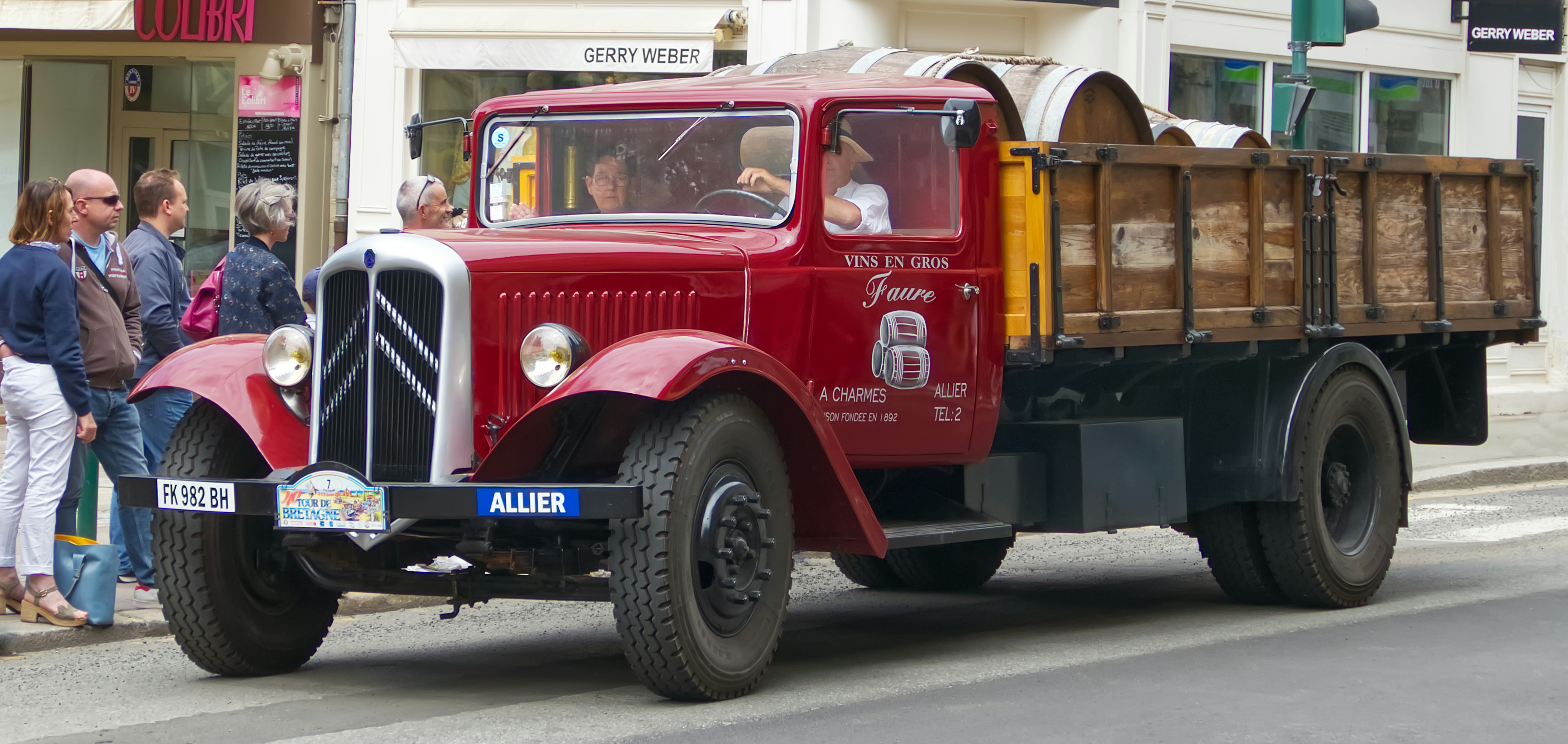 Crimson Classic Truck on a Busy City Block