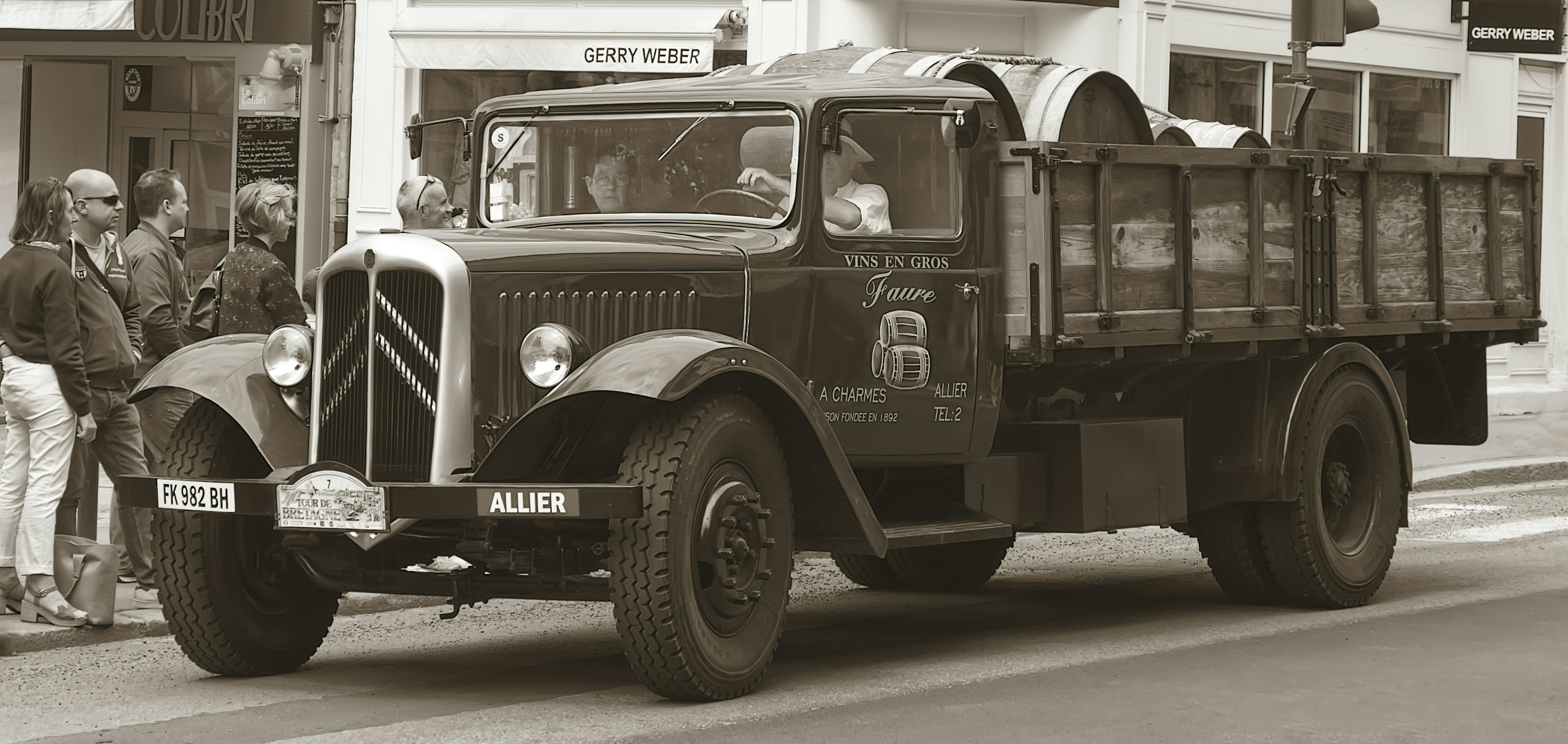 1930s Cargo Truck at the Crosswalk: A Quiet Moment in a Monochrome City