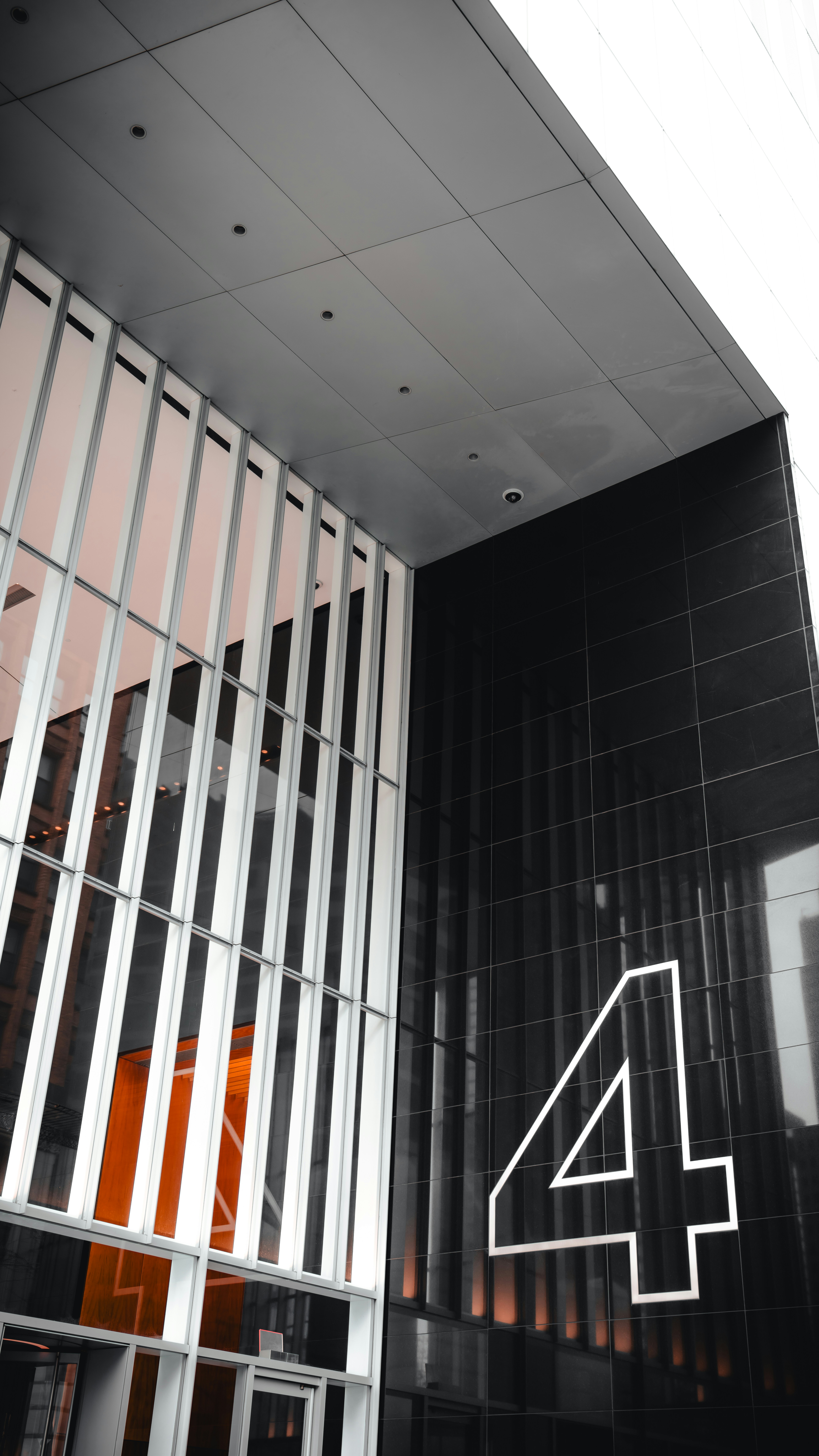 Modern building features a large, white number 4. photo – Free Building ...