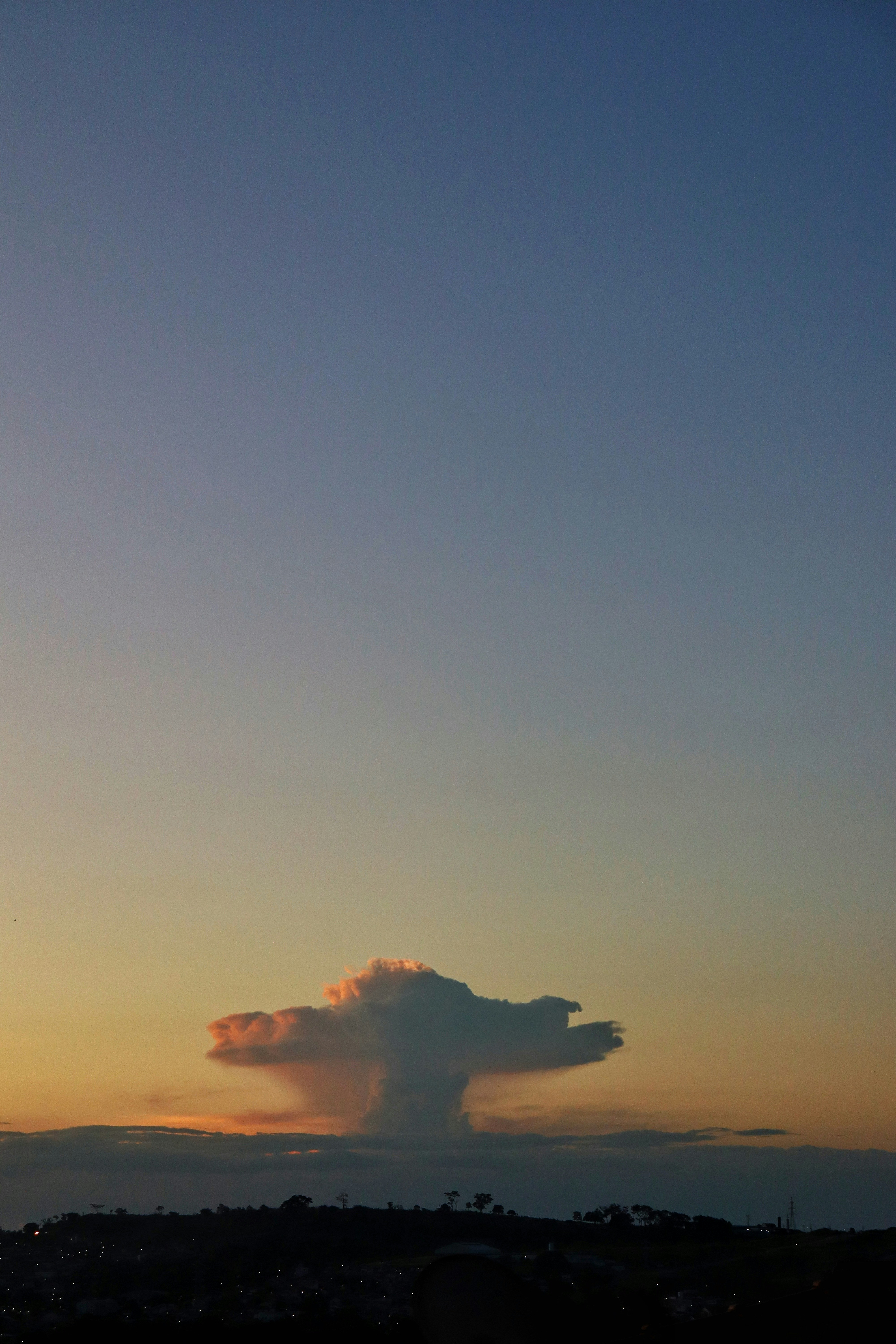 Dusk Mushroom Cloud Rising Over a Quiet Horizon