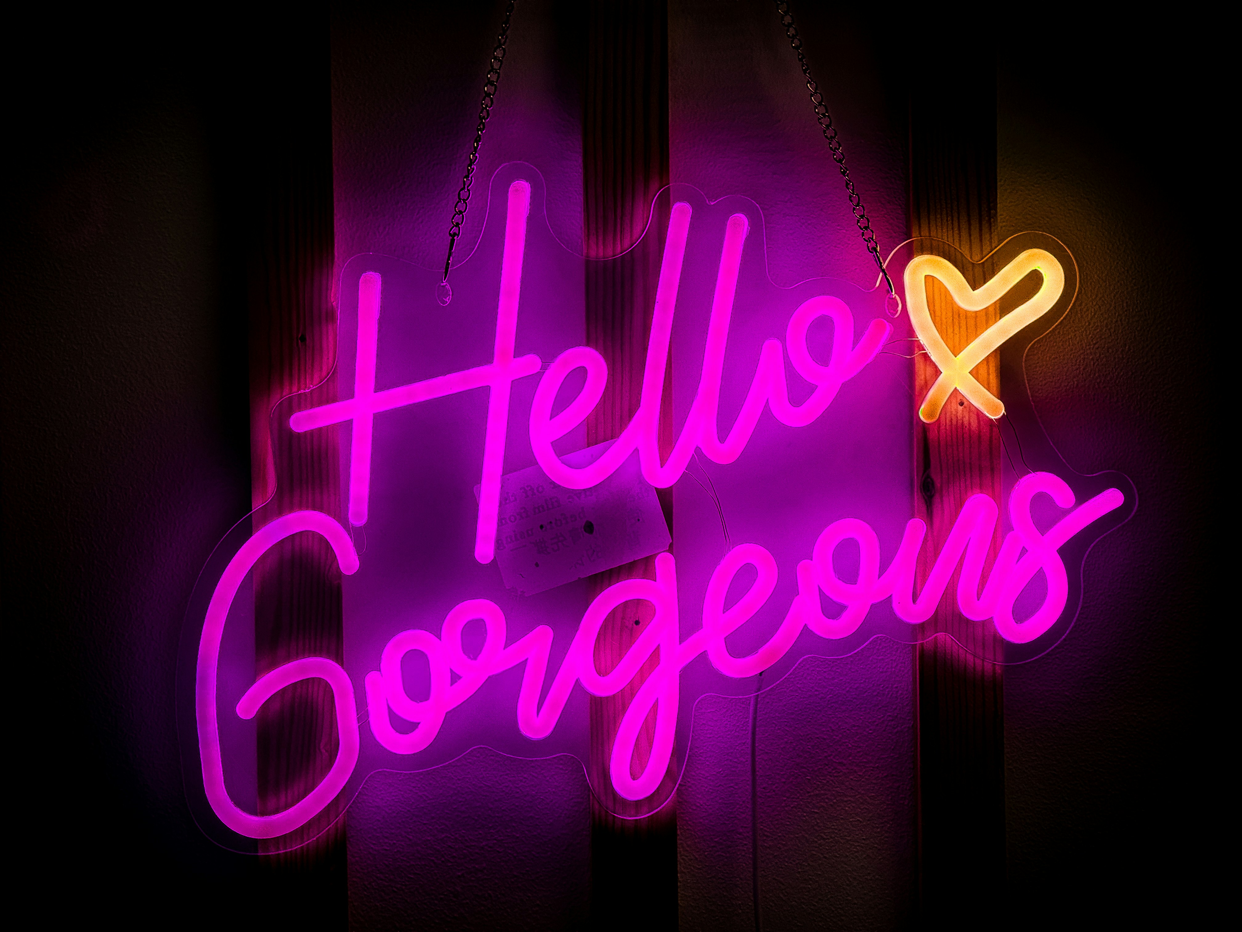 Hello Gorgeous pink neon sign | A neon sign says "hello gorgeous".