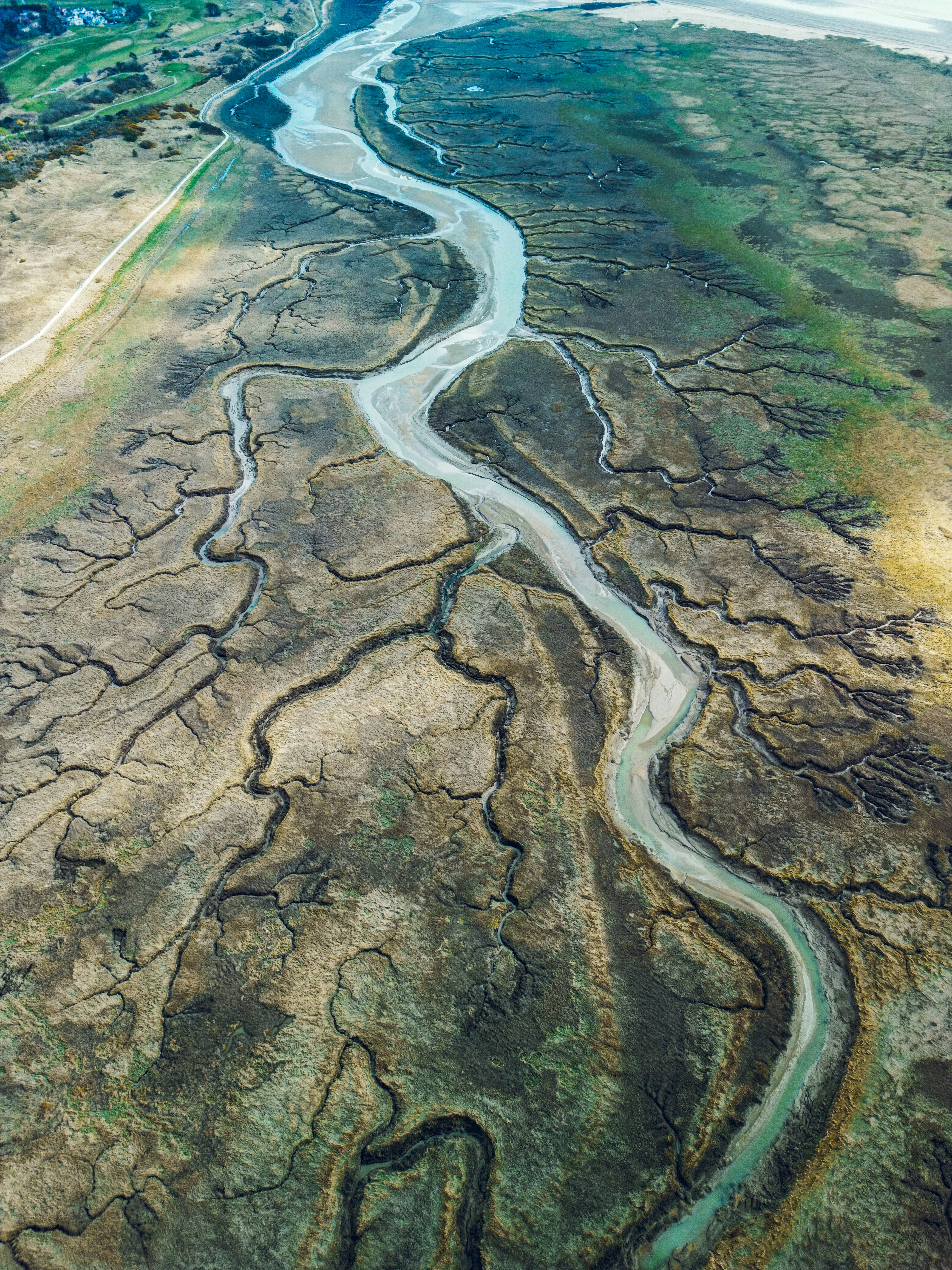 An aerial view of a river and its banks. photo – Free River Image on ...