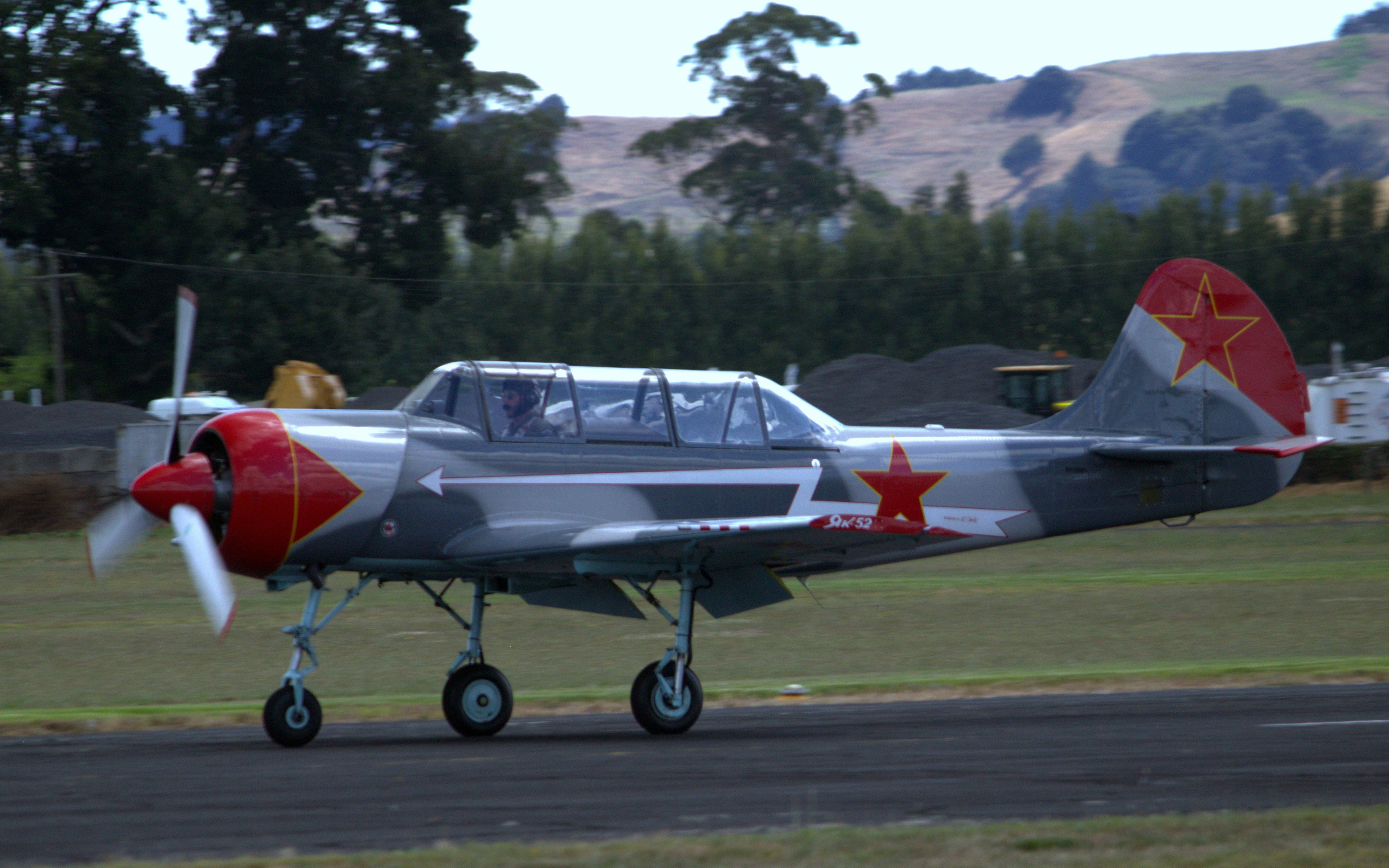 A vintage propeller plane with red star emblems. photo – Free Human ...