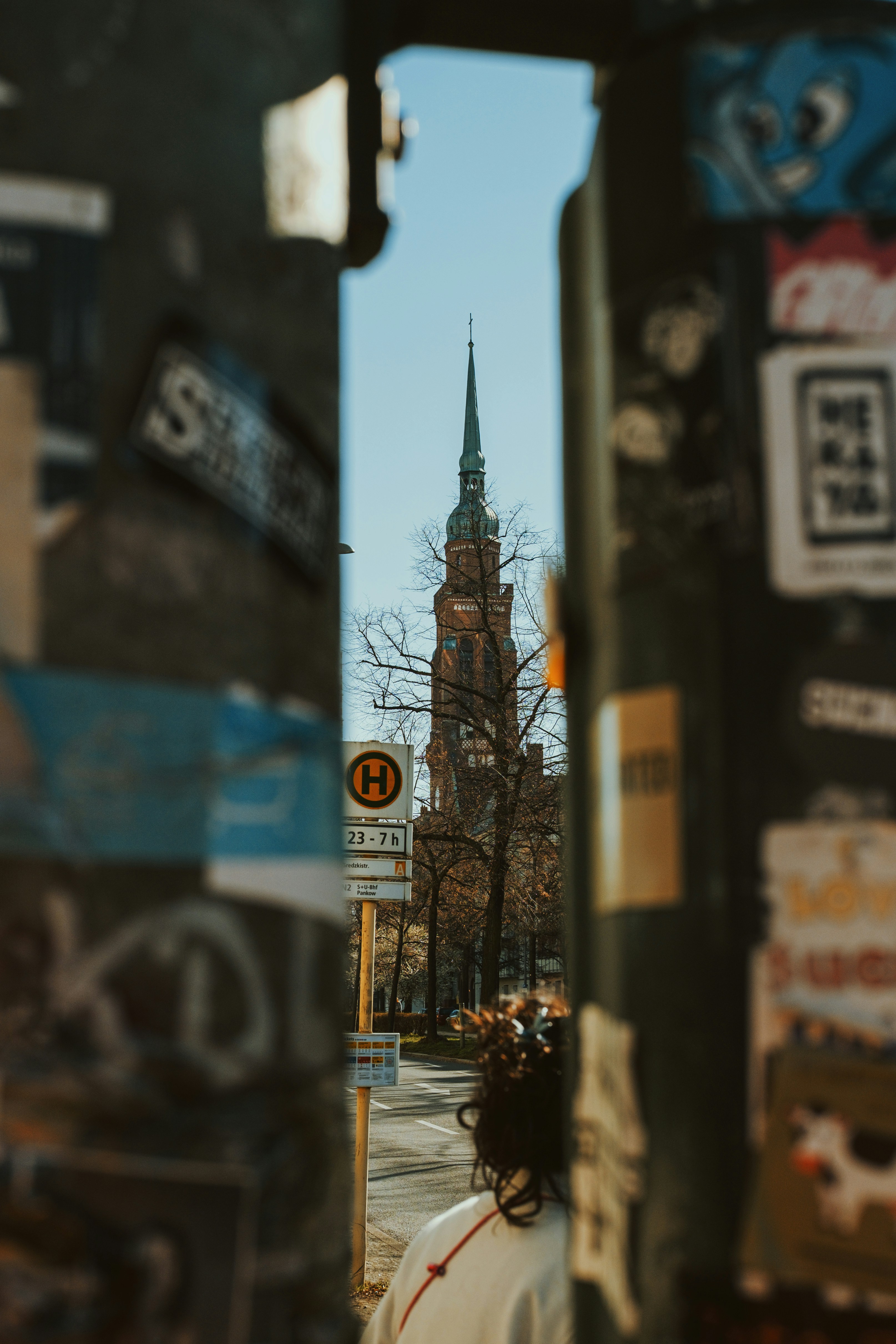 Urban Archways: A Spire Framed by Street Corridors