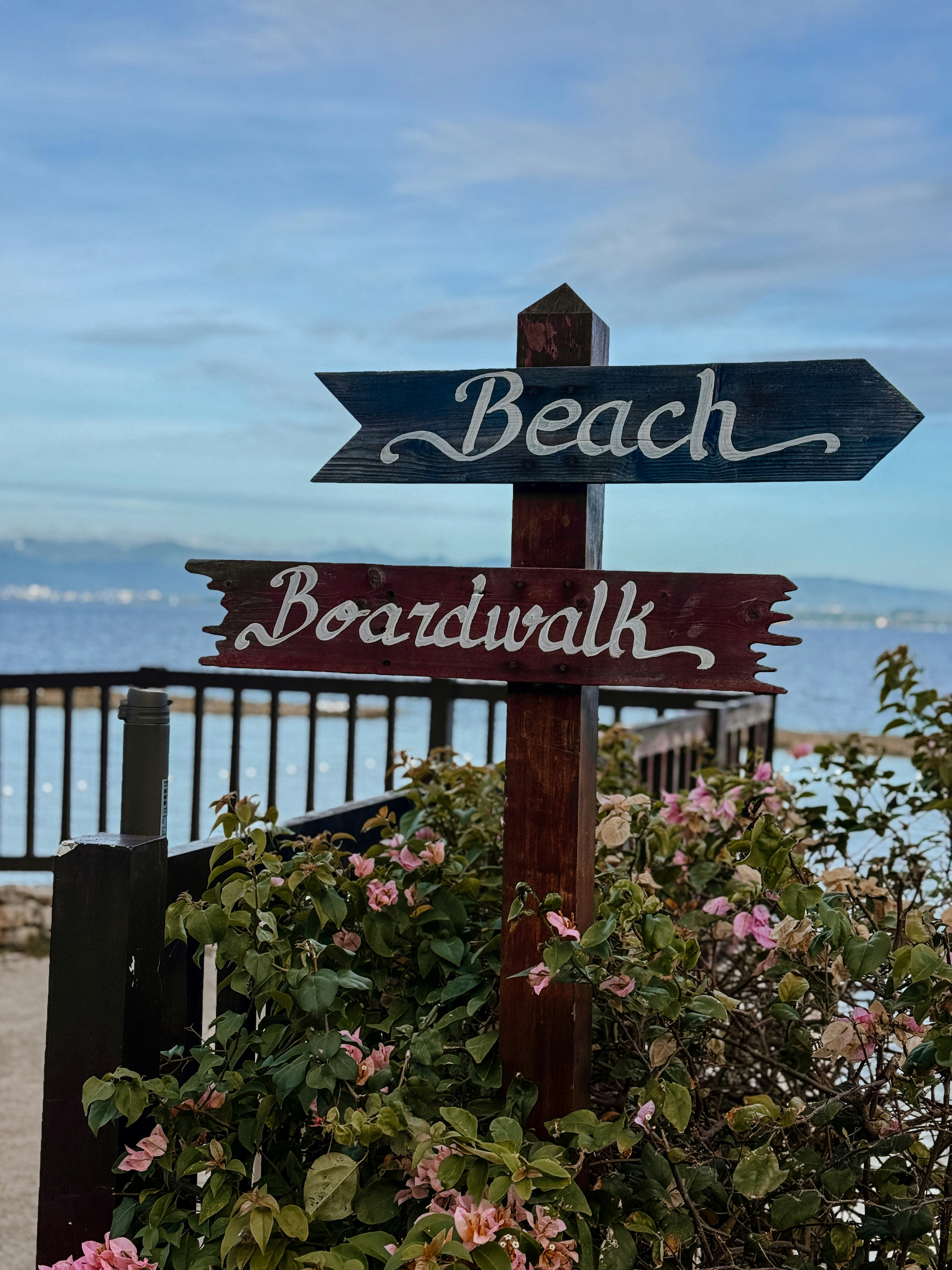 Beach and boardwalk sign points the way.