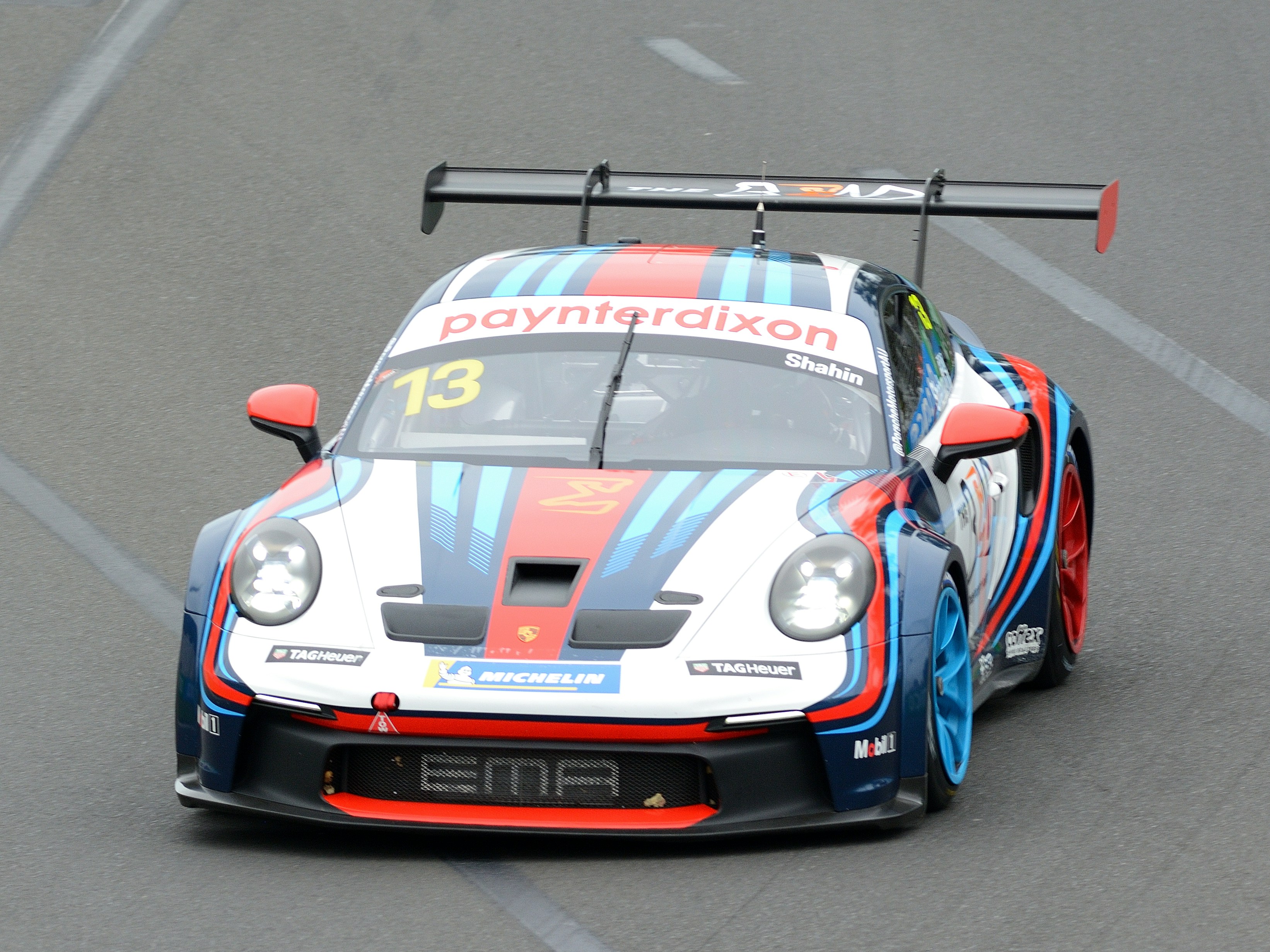 A porsche race car speeds down the track. photo – Free Car Image on ...