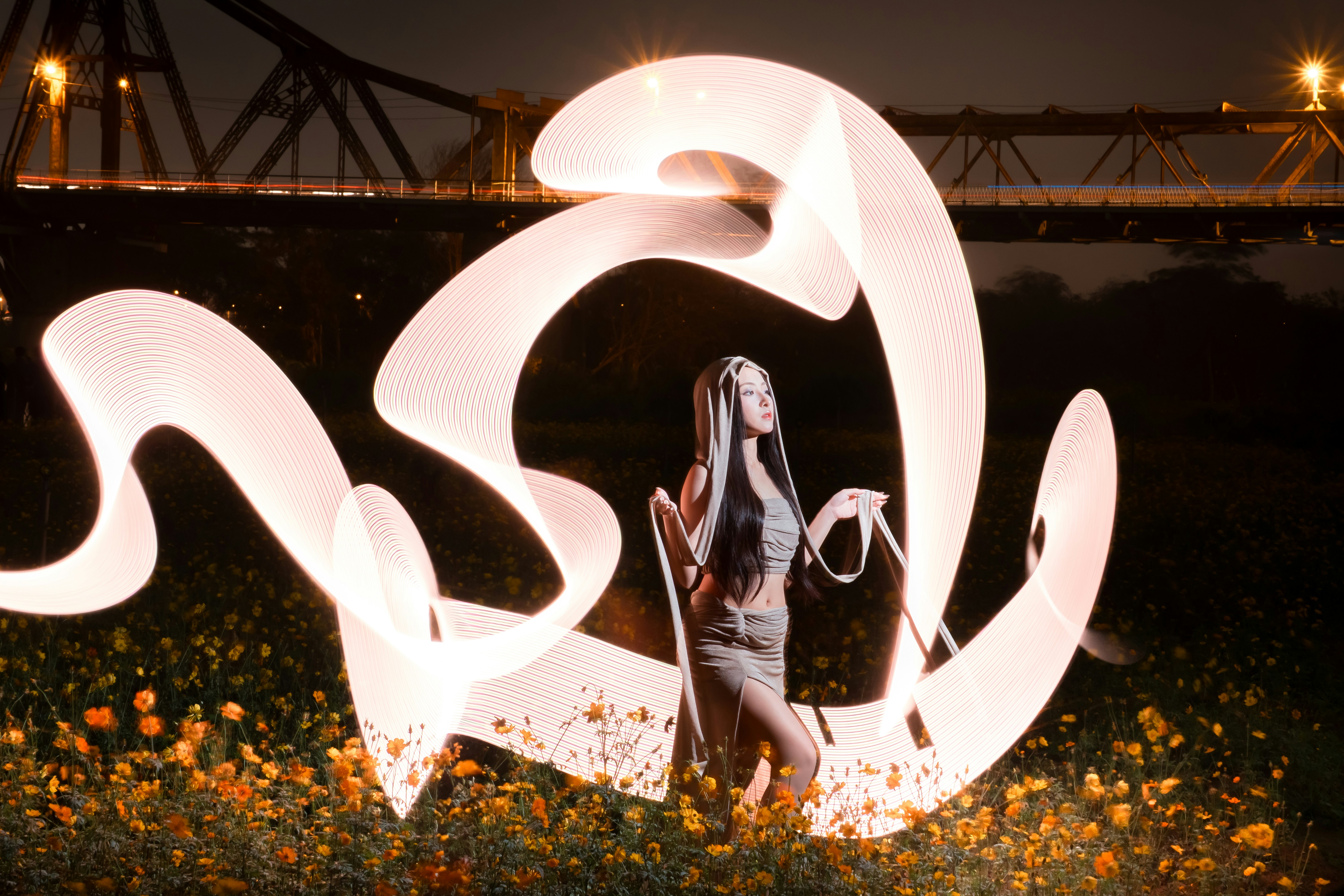 Woman surrounded by bright, glowing light trails. photo – Free Flowers ...
