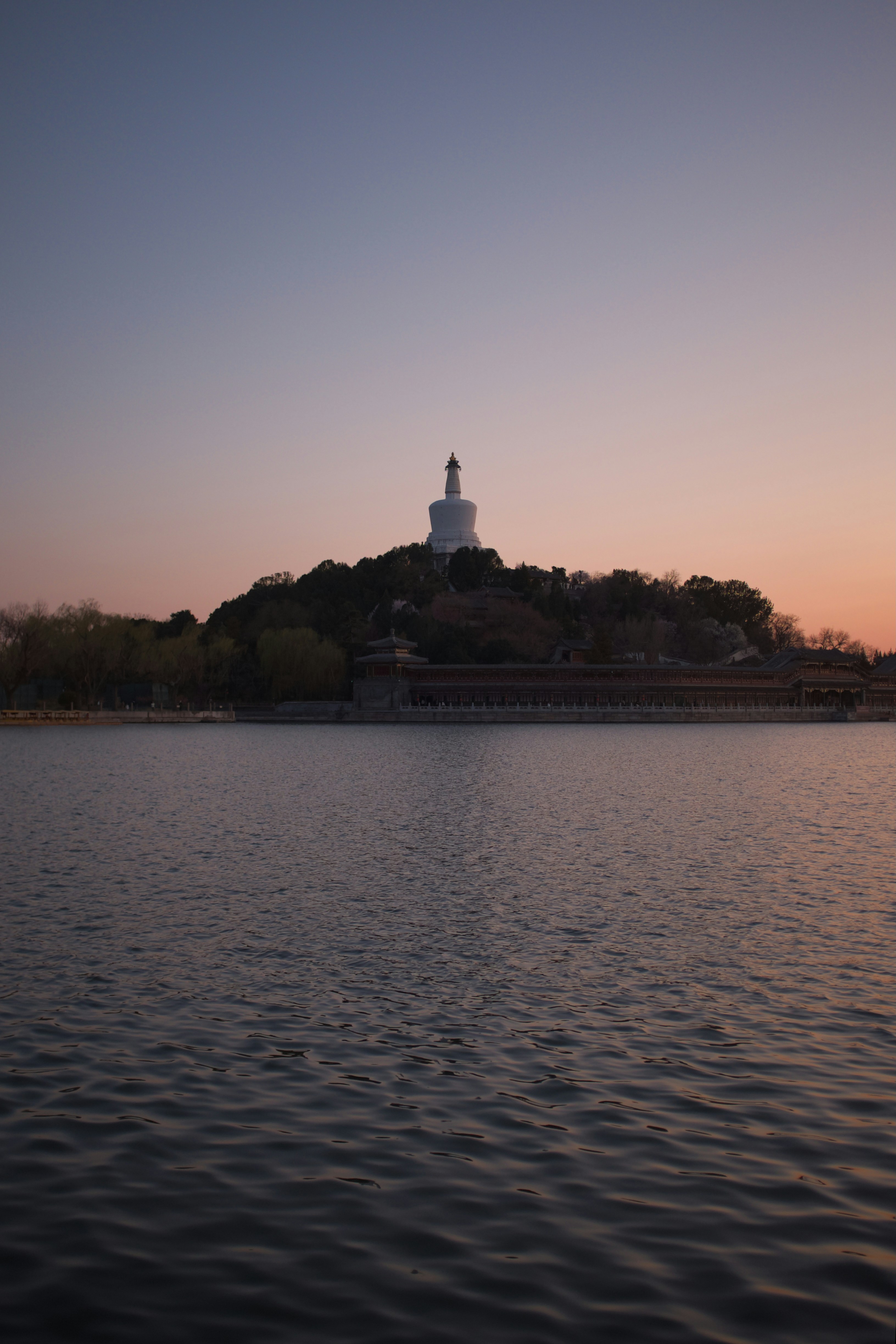 Dusk over Beihai Hill: The White Dagoba Rising Above Tranquil Waters