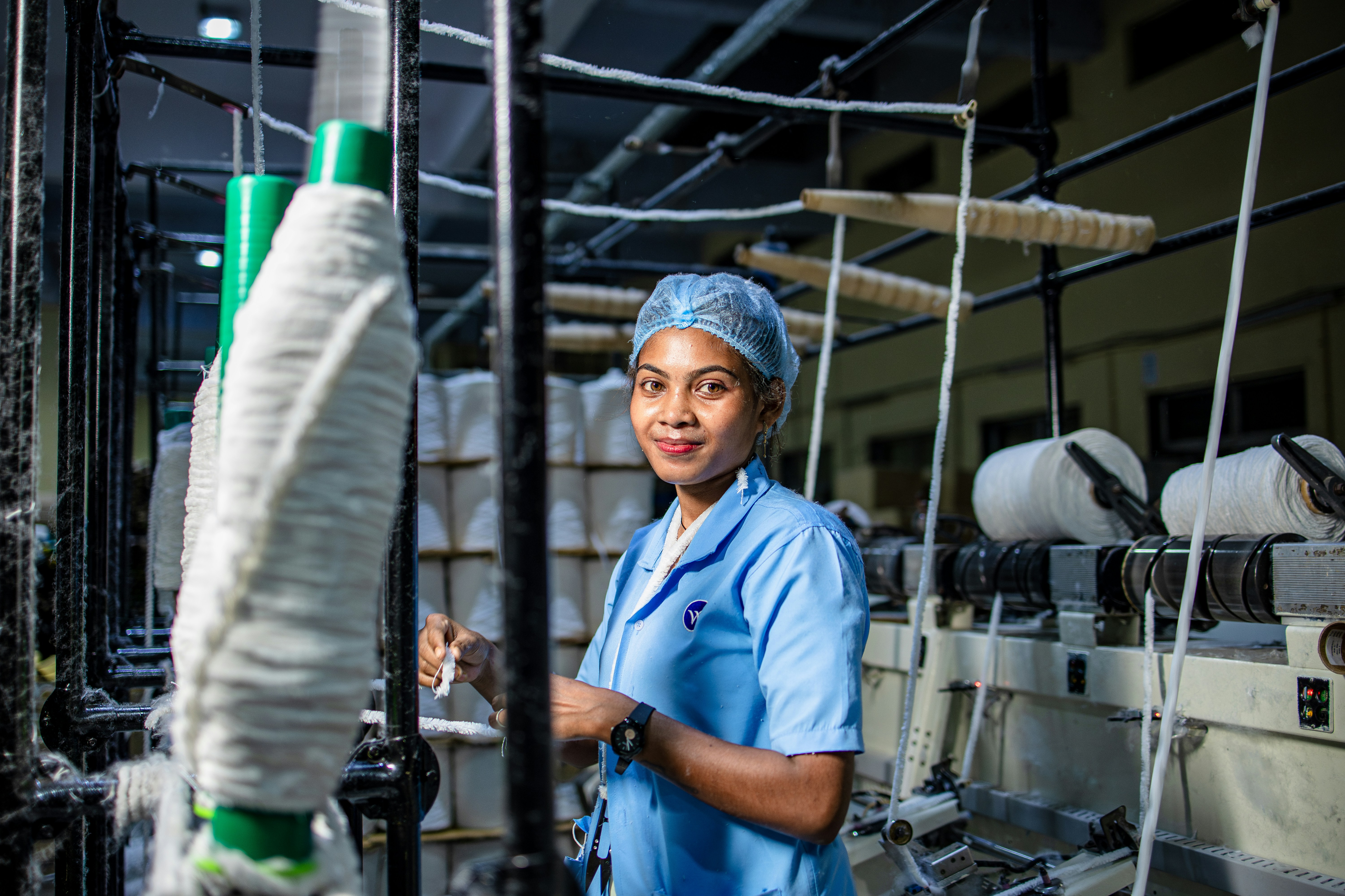 Woman works in a textile manufacturing facility. photo – Free Woman ...