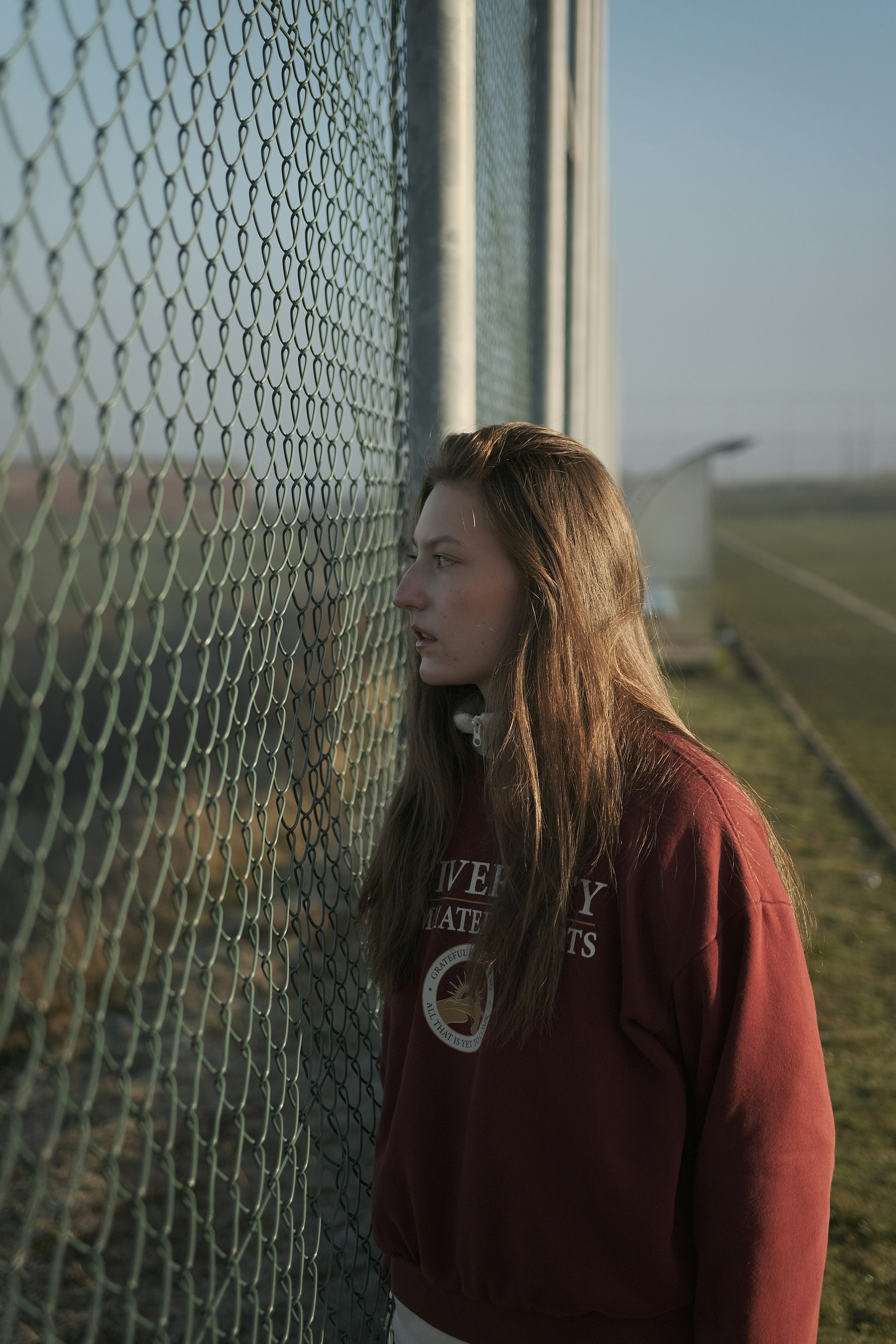 Fence Line Portrait: A Quiet Gaze by the Field