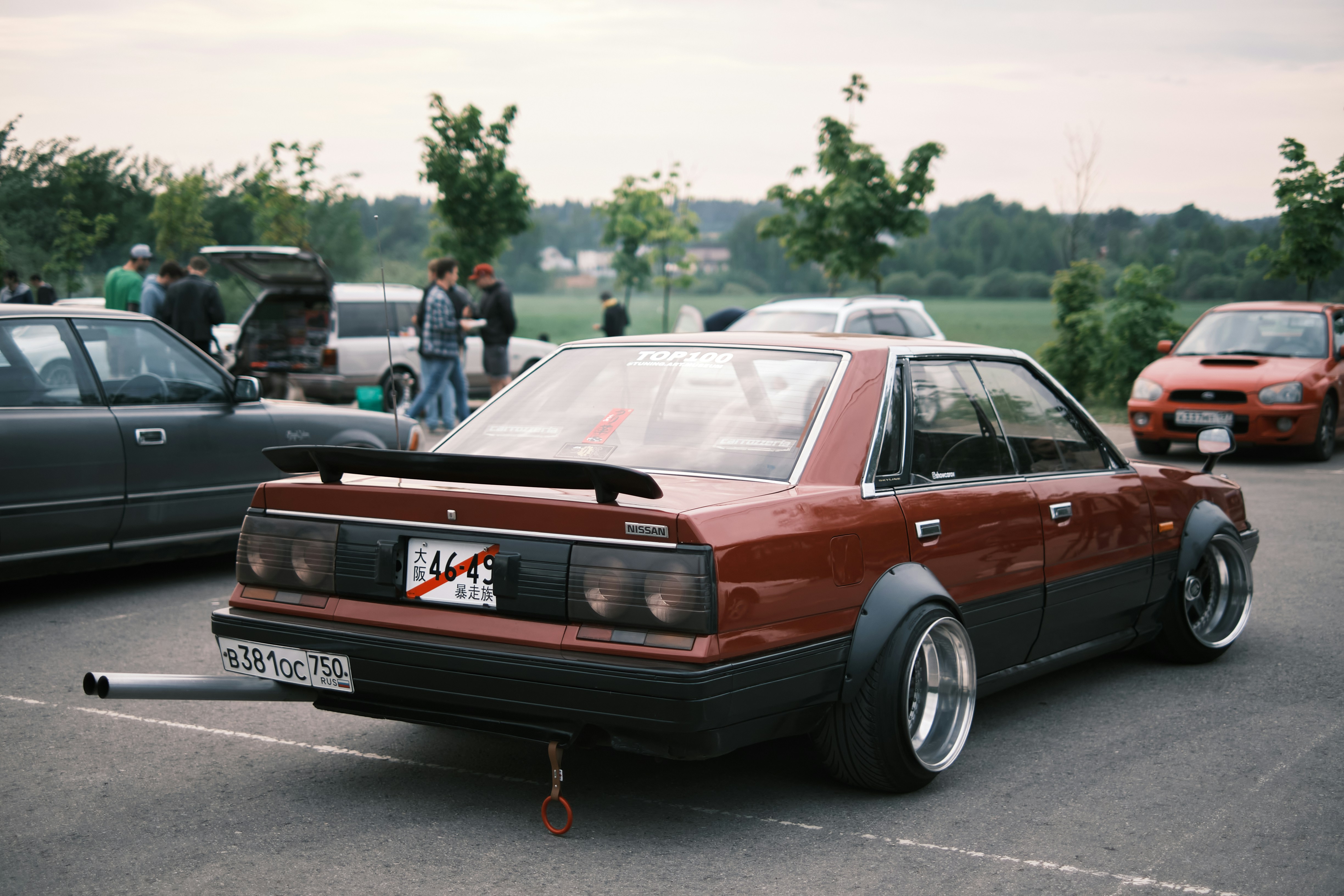 A modified car shows off its wheels. photo – Free Car Image on Unsplash