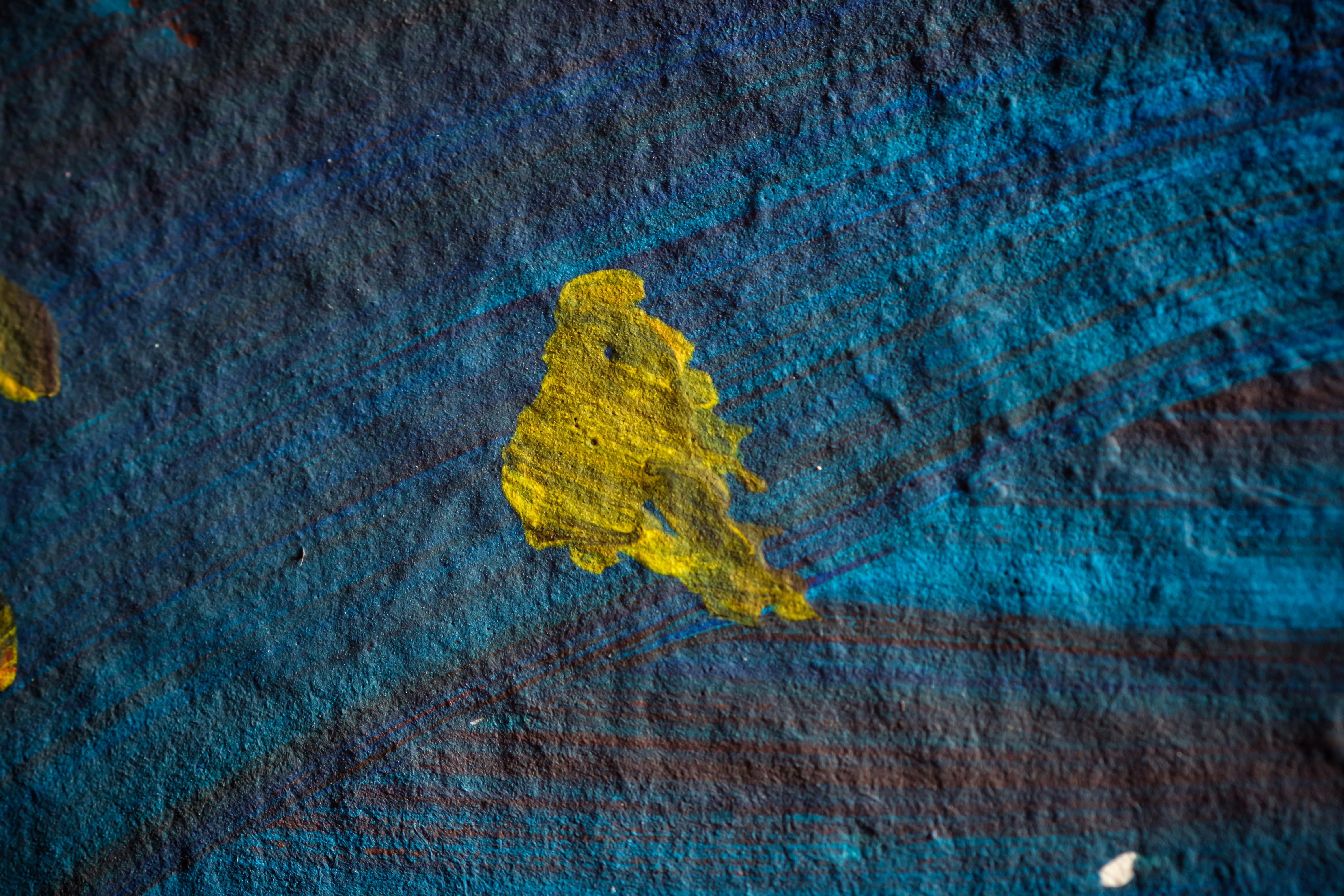 Canary on Indigo: An Abstract Yellow Mark on a Weathered Blue Wall