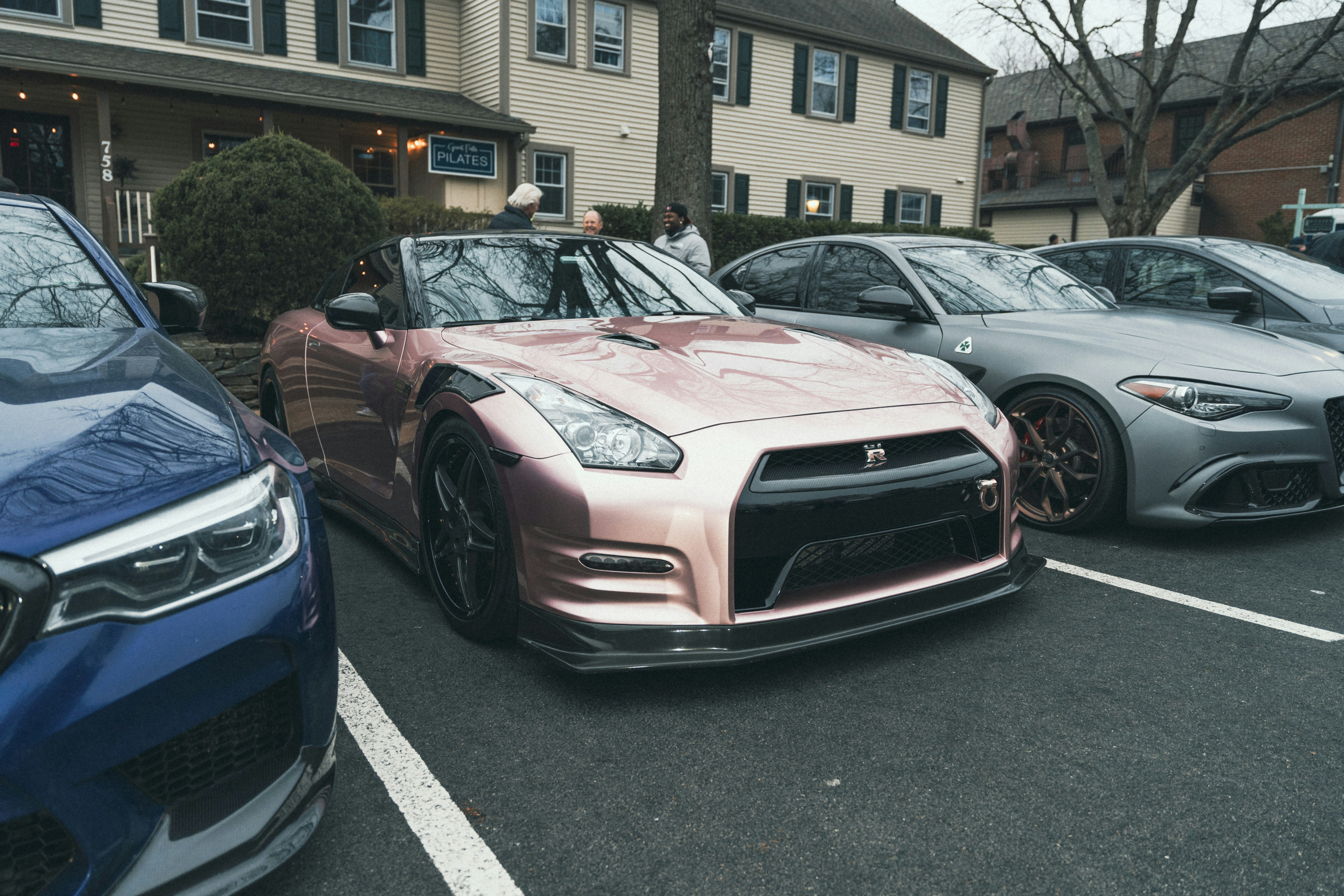 Flushed Pink GT-R: A Bold Spotlight in a Suburban Parking Row