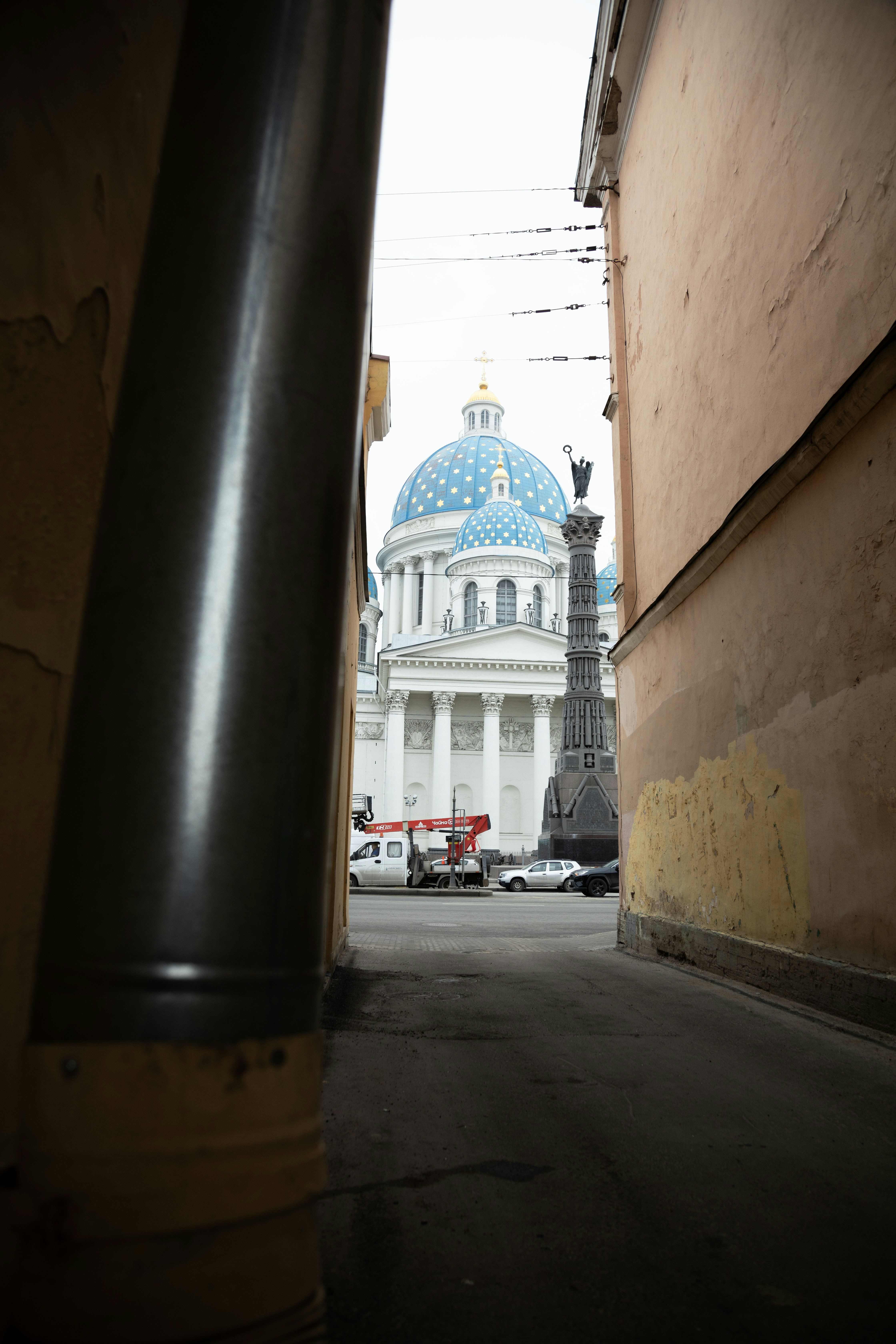 A church and monument stand in the distance. photo – Free St ...