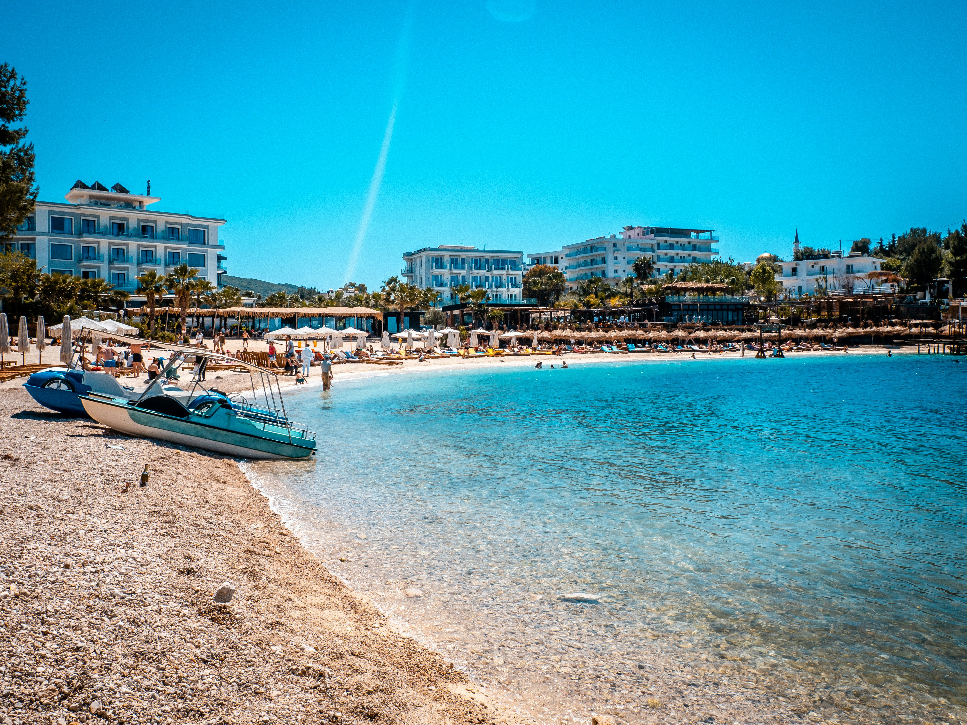 Beautiful beach scene with clear water and resorts. photo – Free Beach ...