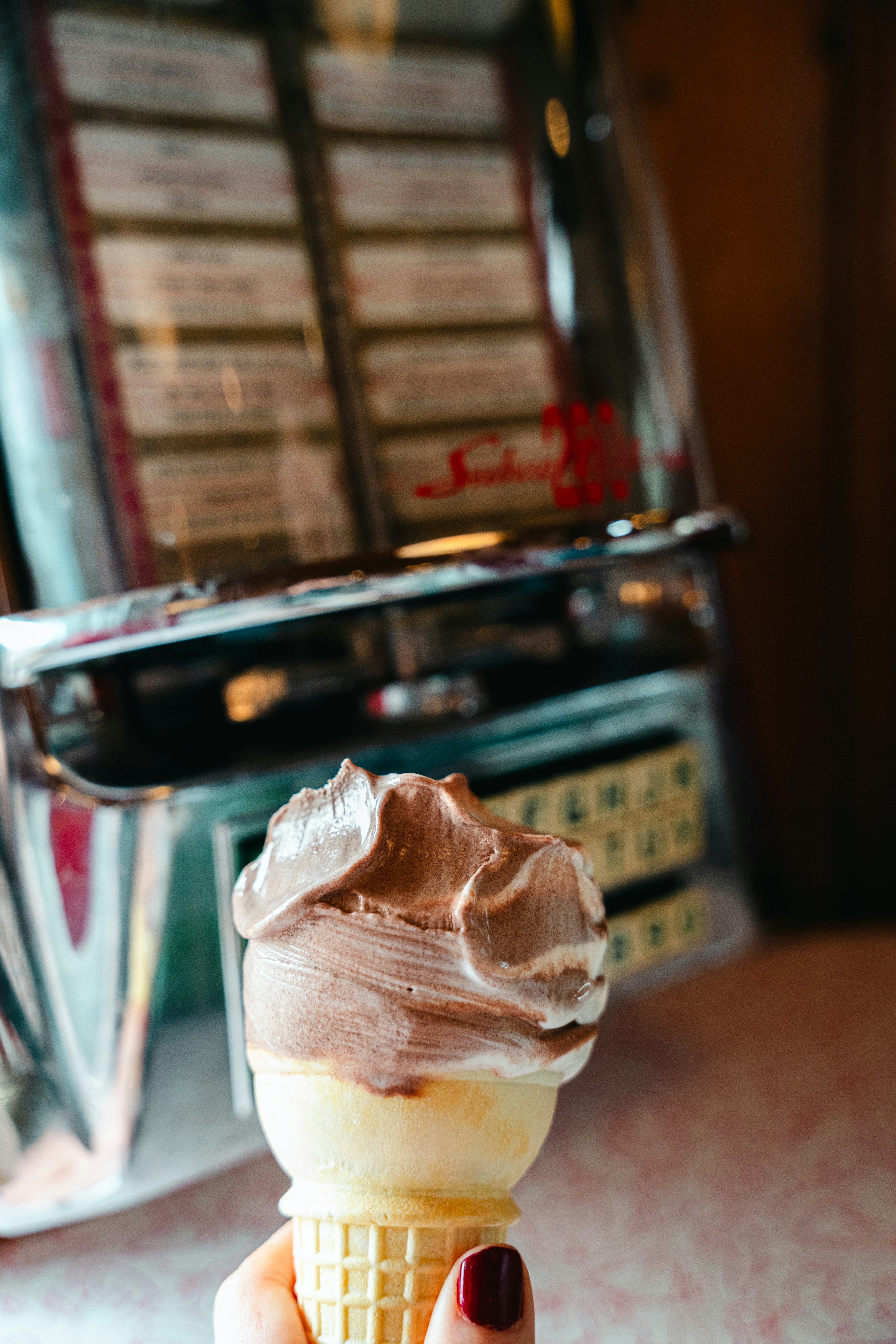 Soft-Serve Spotlight: A Cone in Front of a Vintage Jukebox