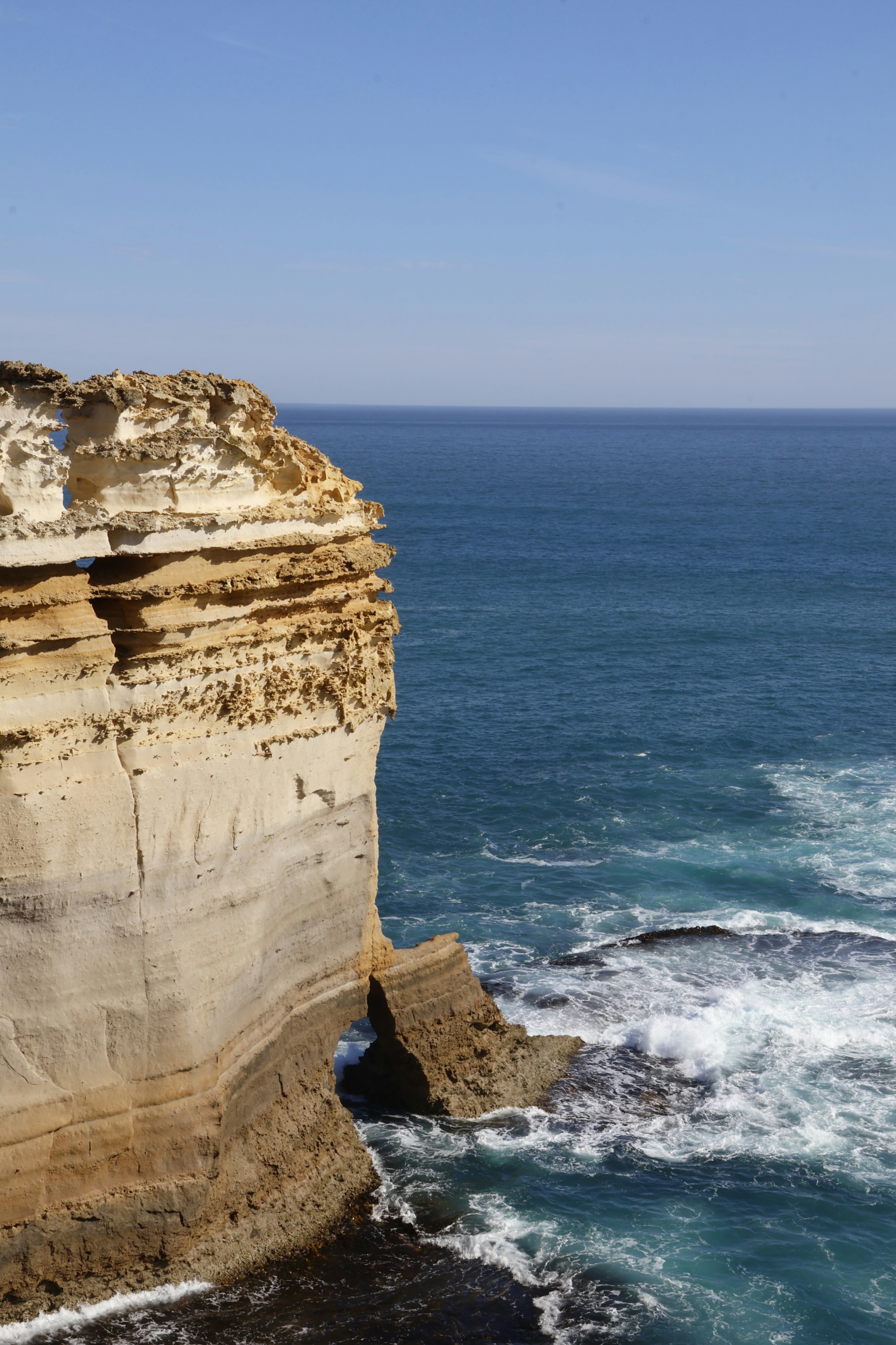 Coastal cliffs meet the blue ocean under a clear sky. photo – Free ...