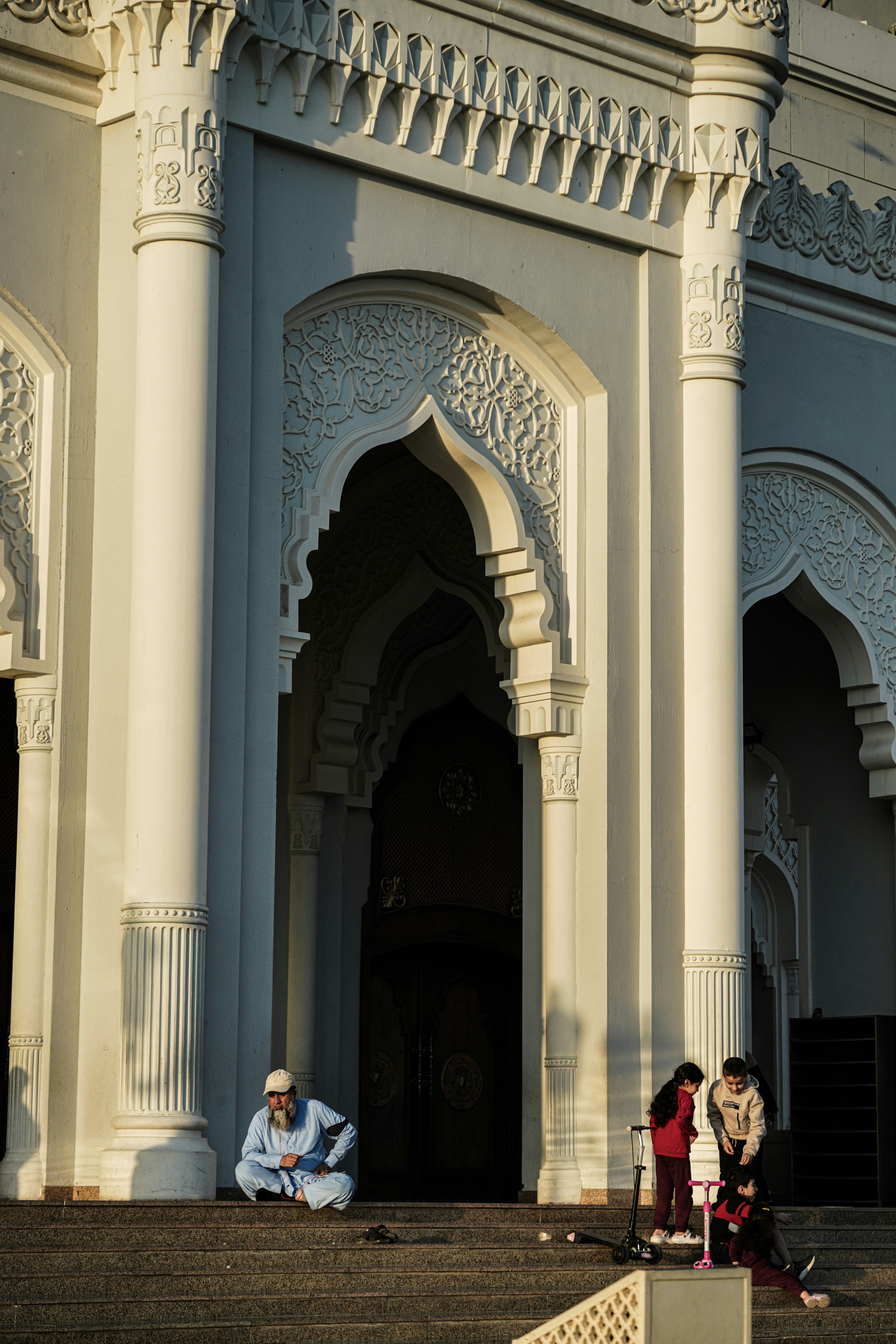Threshold of Light: Carved Archways and Quiet Life on the Steps