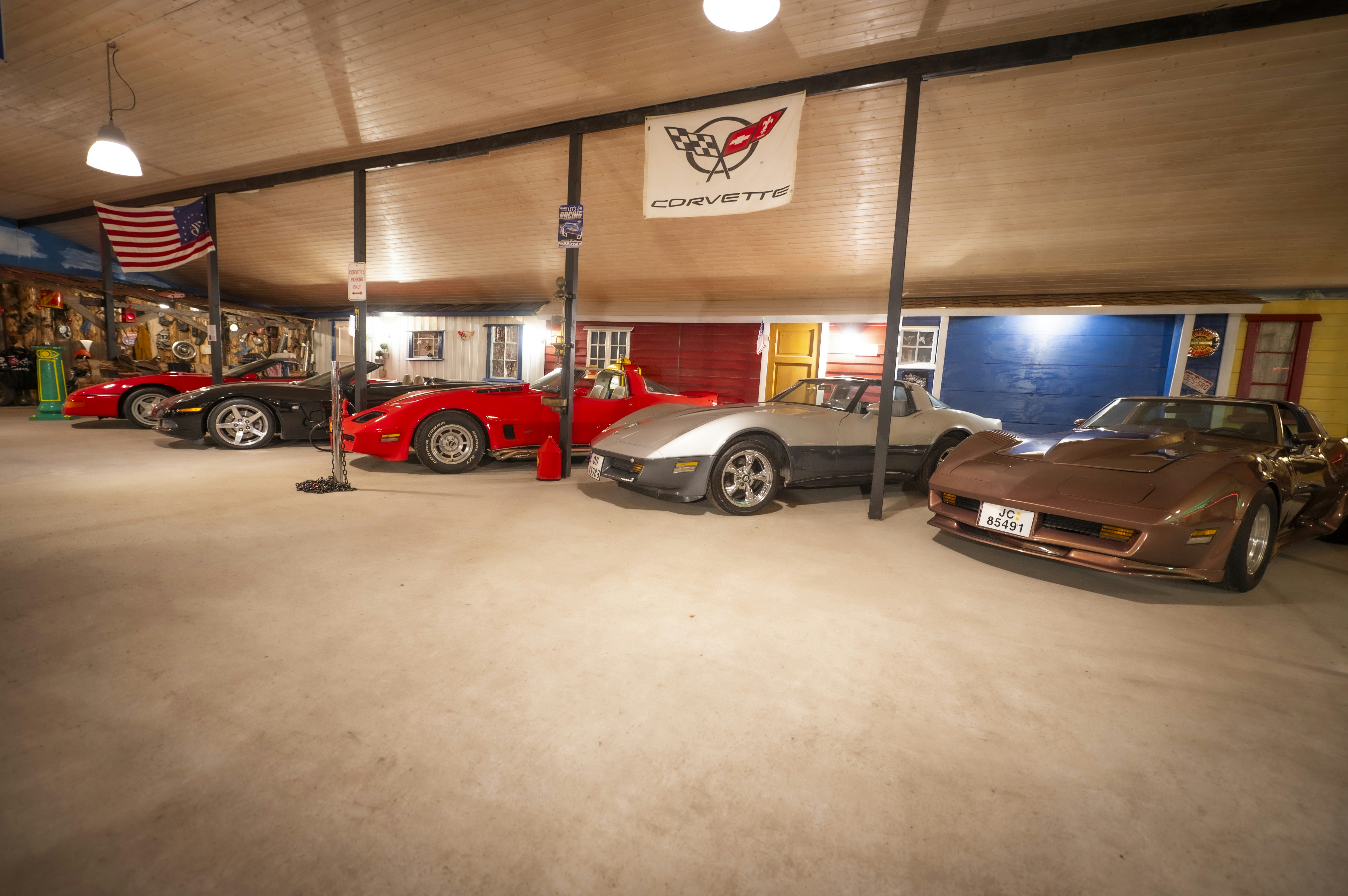 A collection of classic corvettes on display. photo – Free Car Image on ...