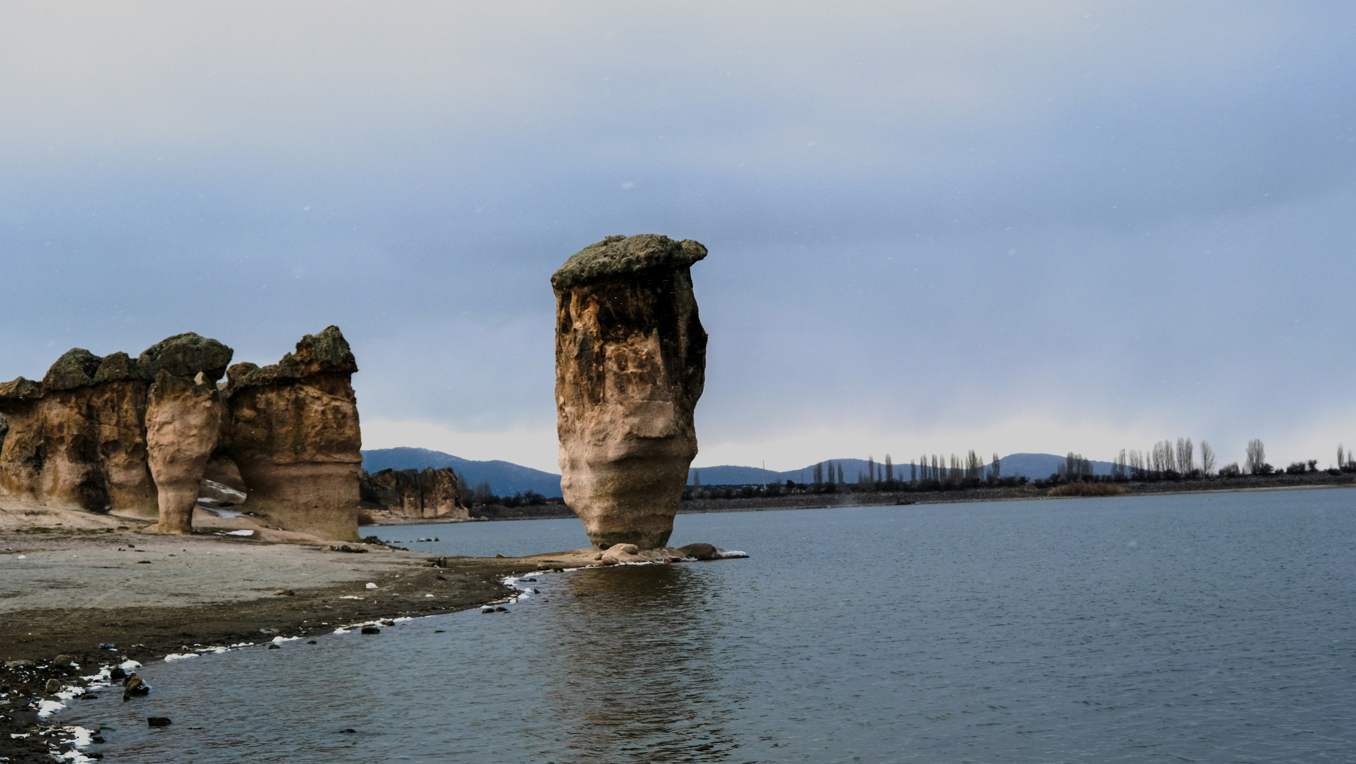 Solitary Pillar Amidst Tranquil Waters