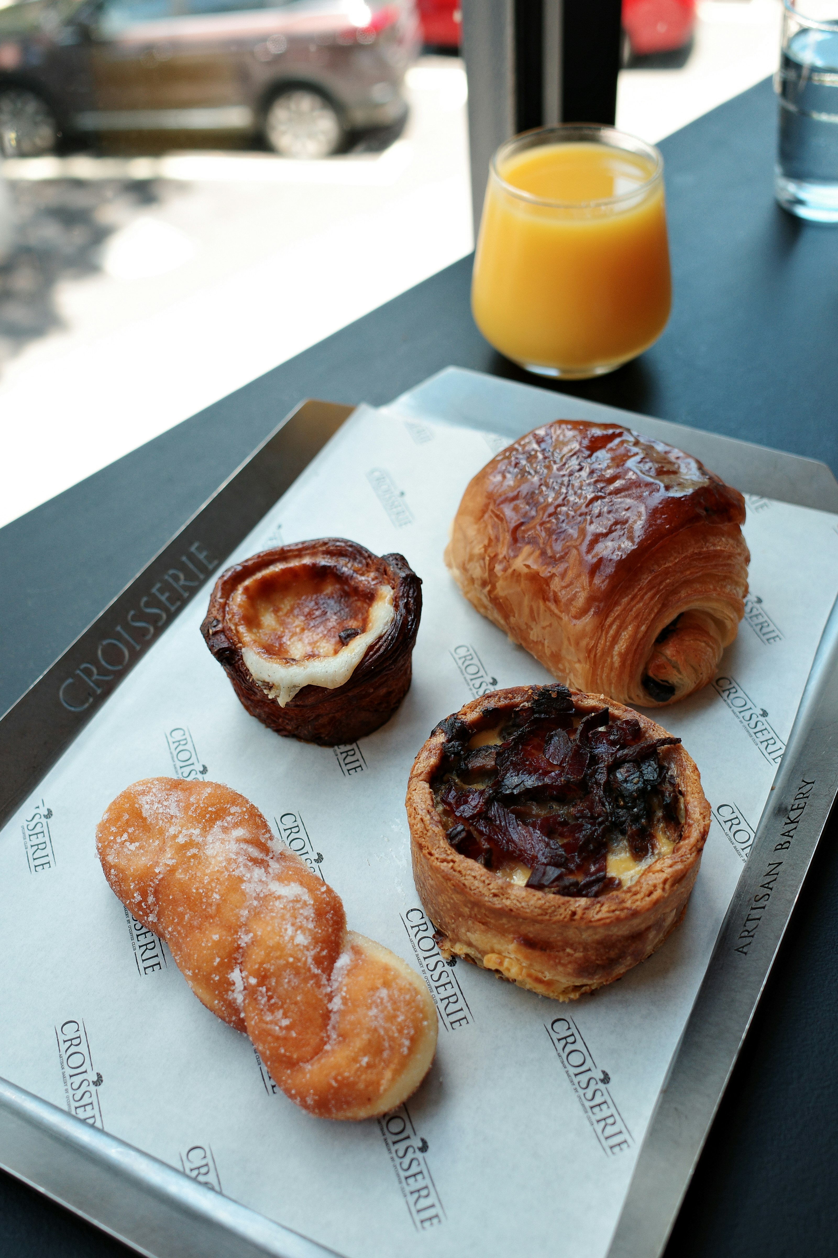 Delicious pastries and juice await a hungry person.