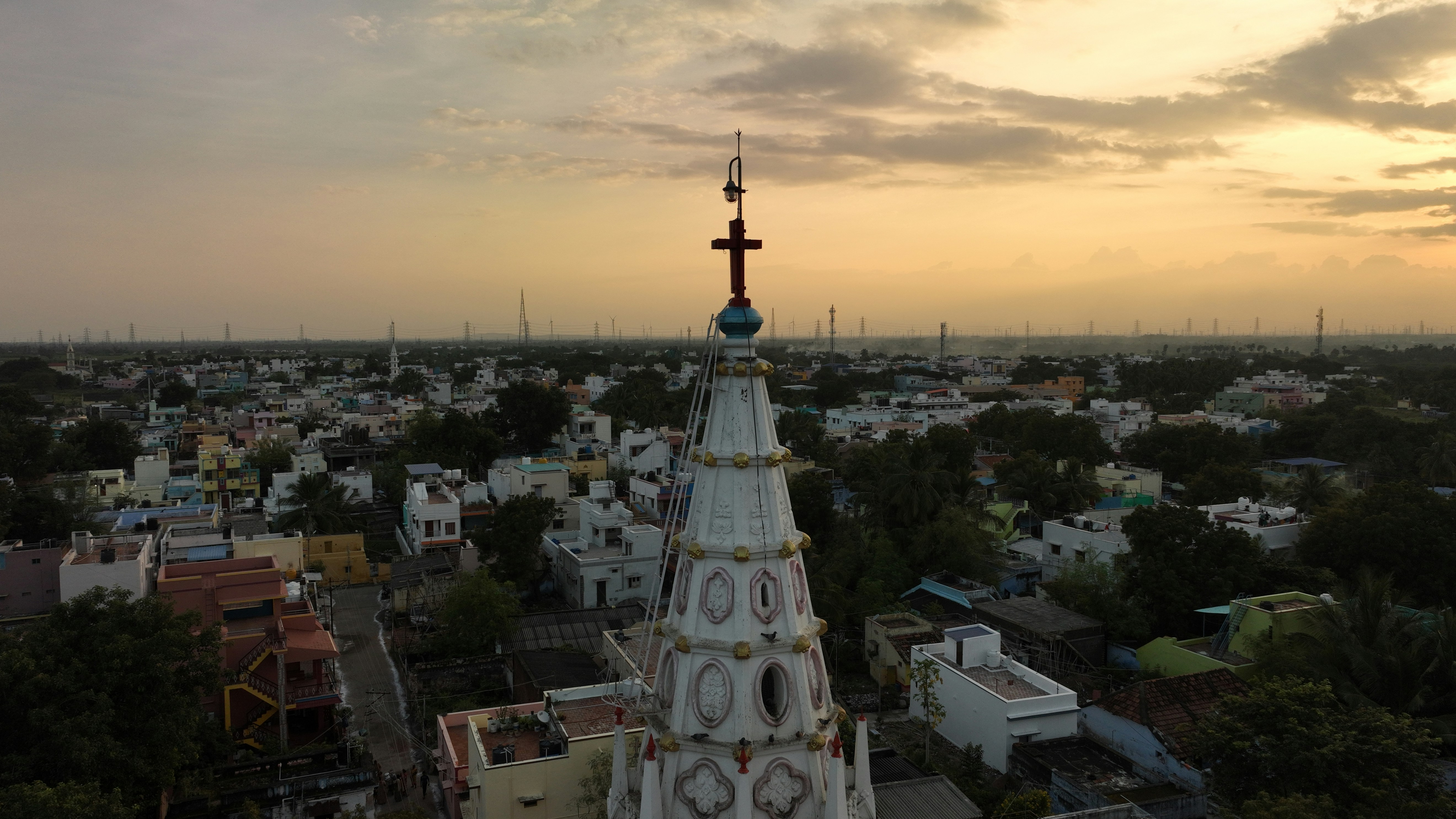 Amber Dusk Over a City Crowned by a White Temple Spire