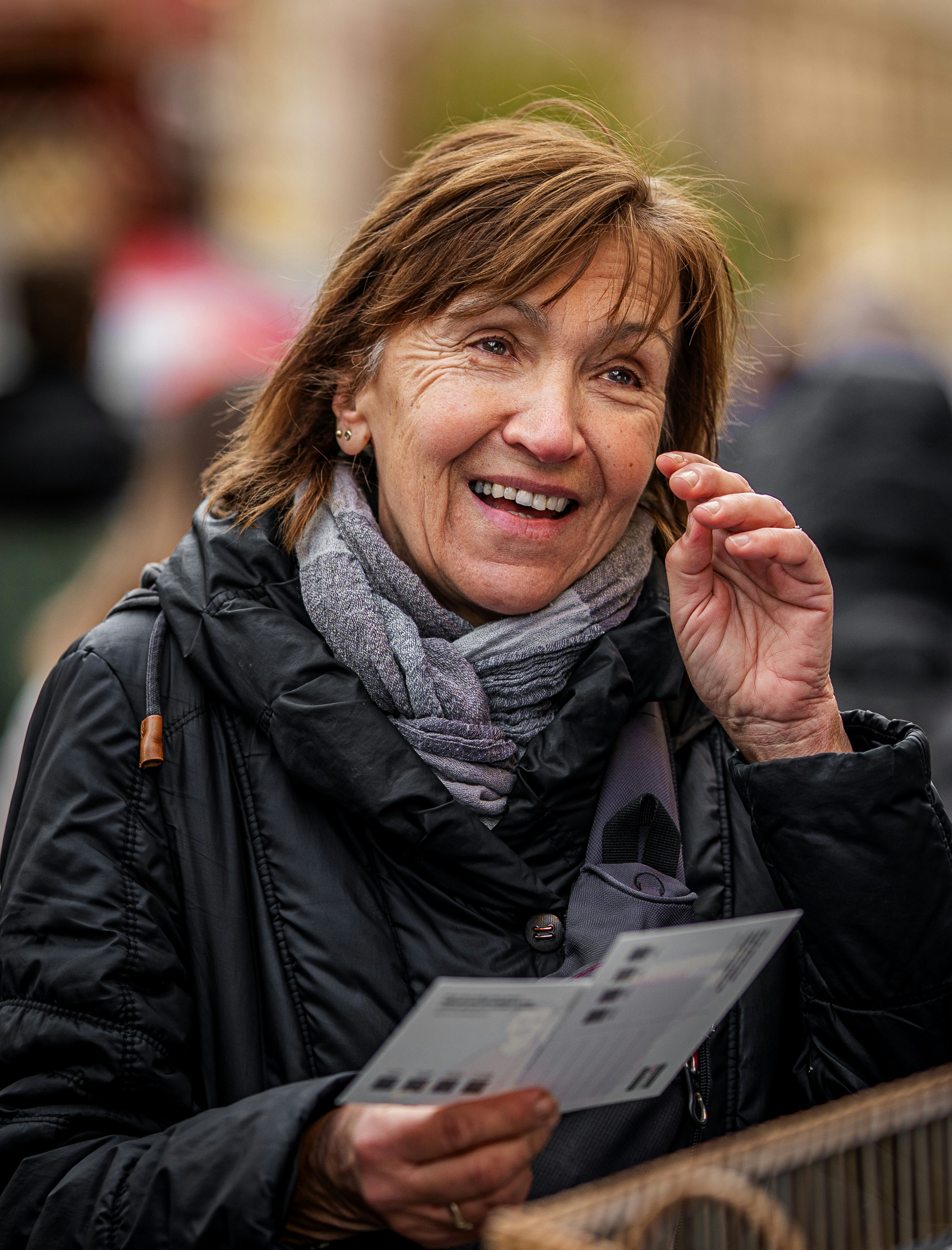 Smiling woman holding a document, looking happy. photo – Free Woman ...