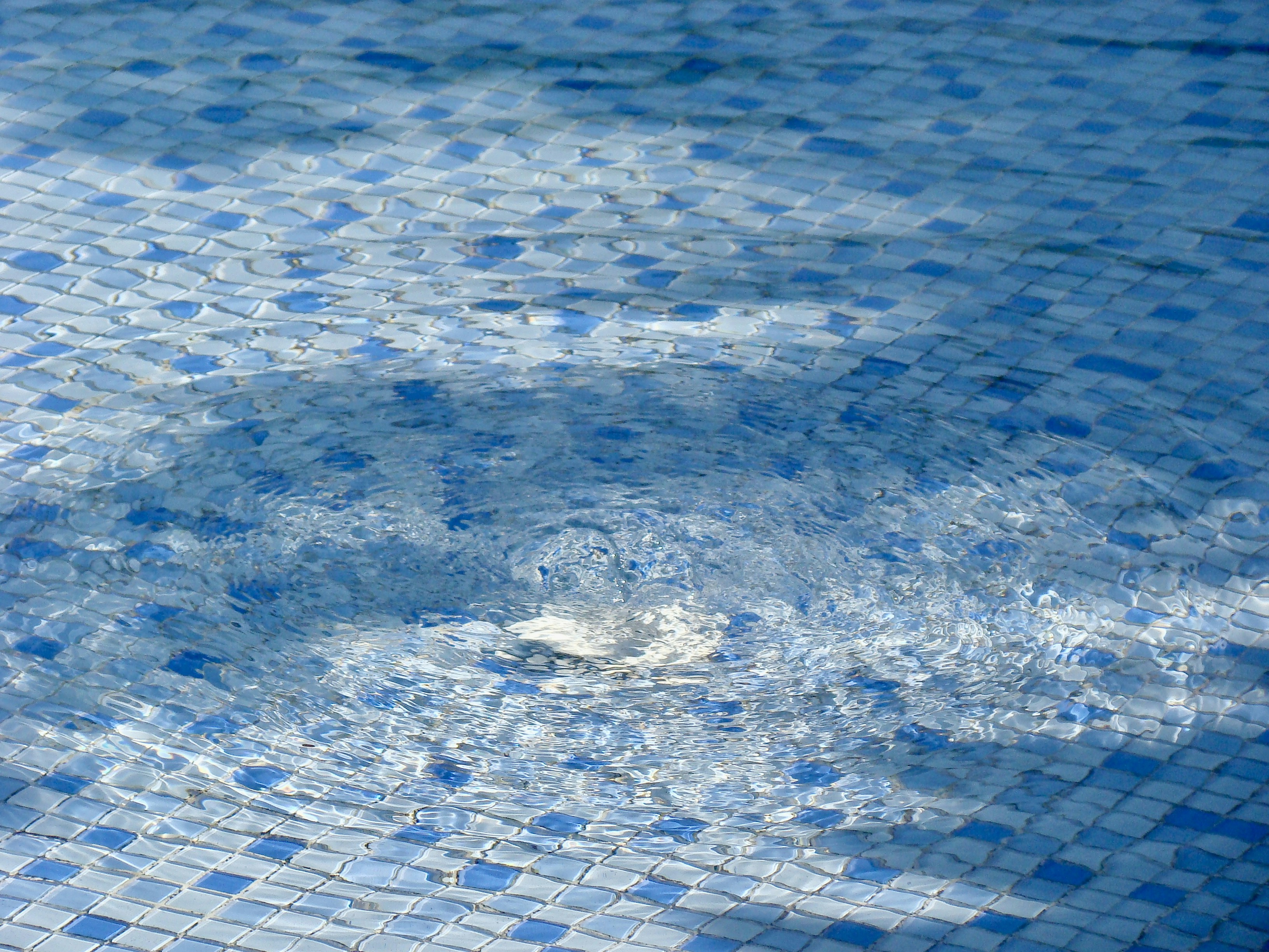 Water ripples across a pool's blue, tiled surface. photo – Free Pool ...