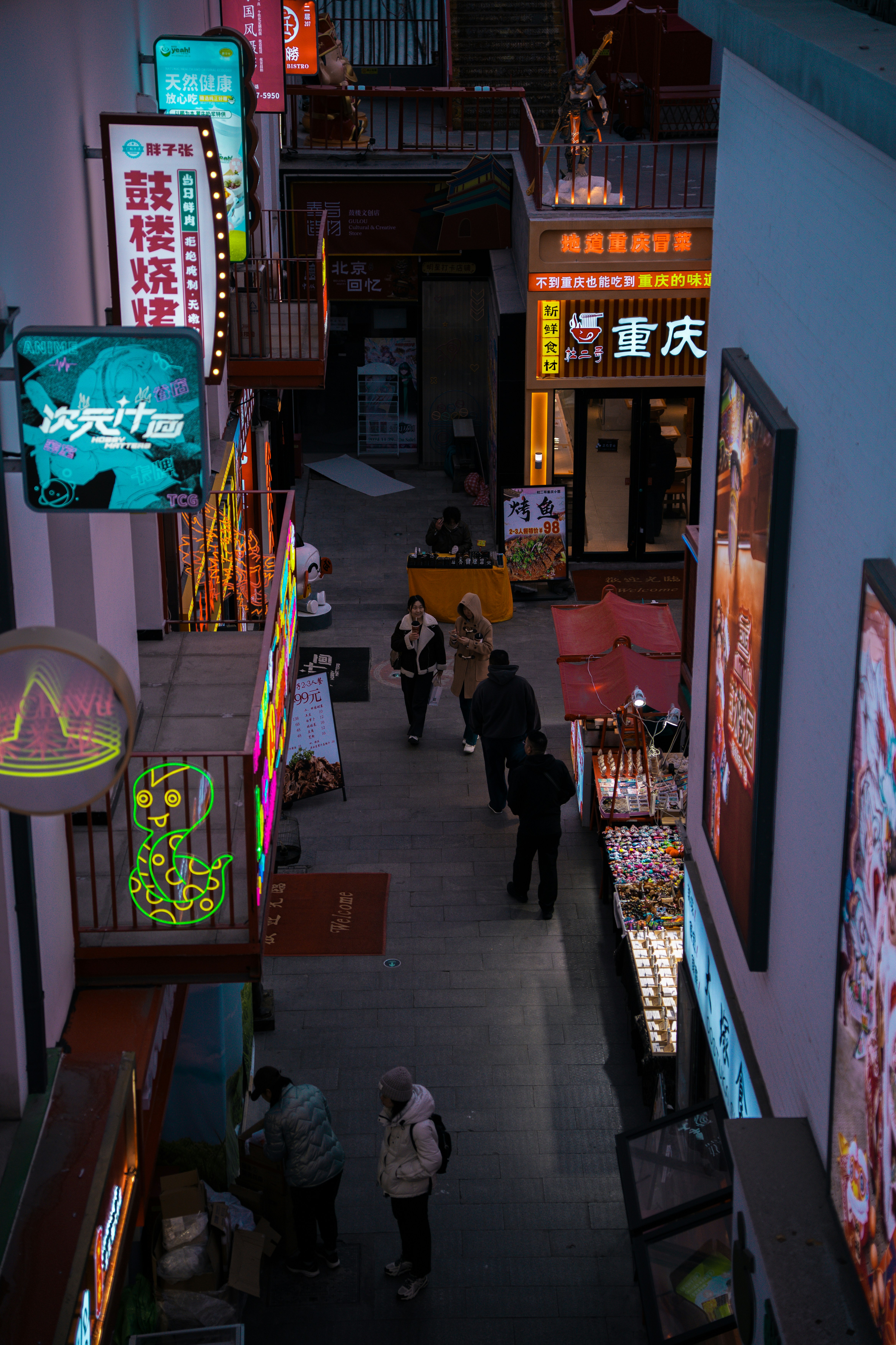 Colorful neon signs illuminate a narrow street at dusk. photo – Free ...
