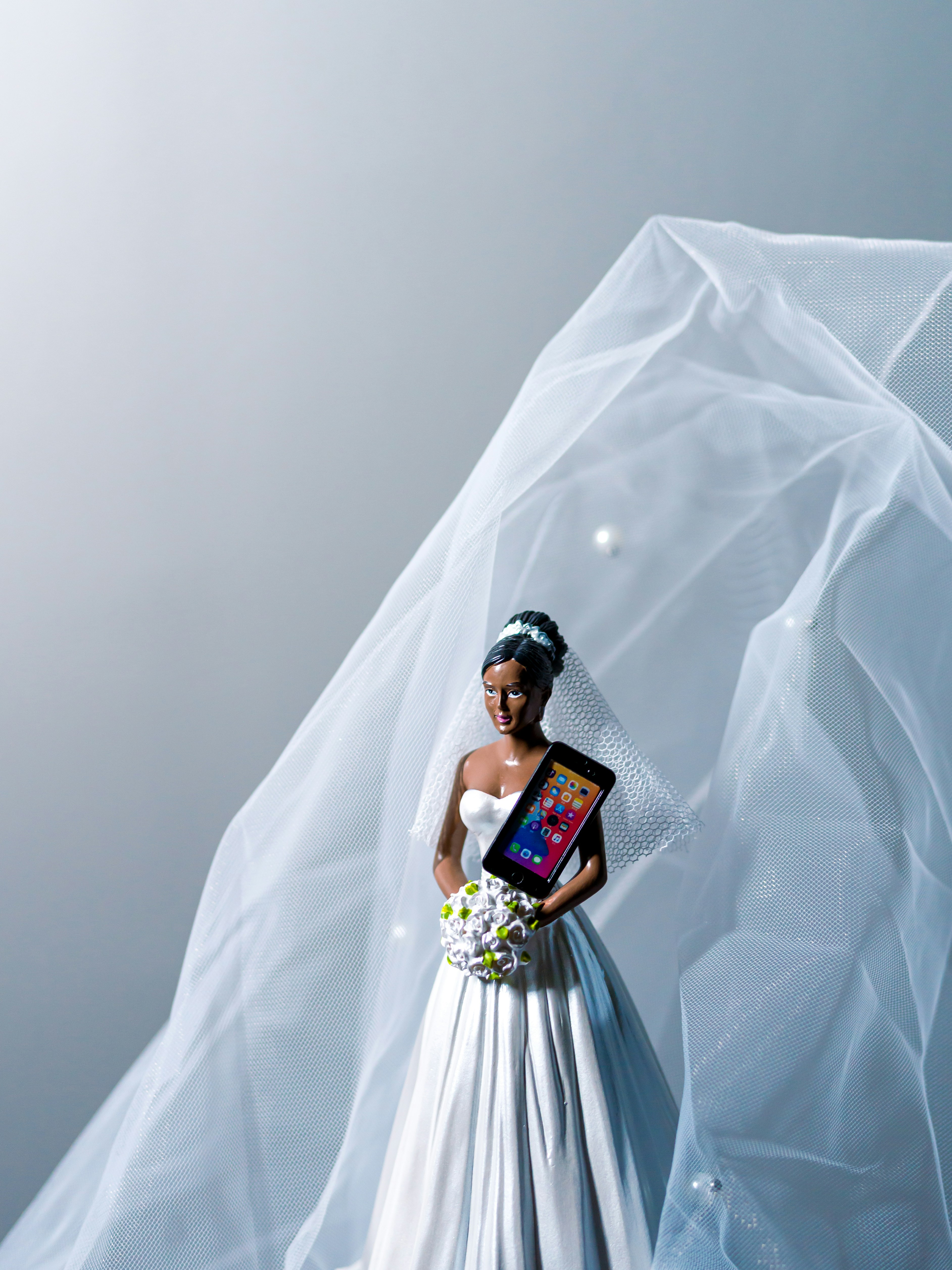 Bride figurine holding a tablet, beneath a veil. photo – Free Flower ...
