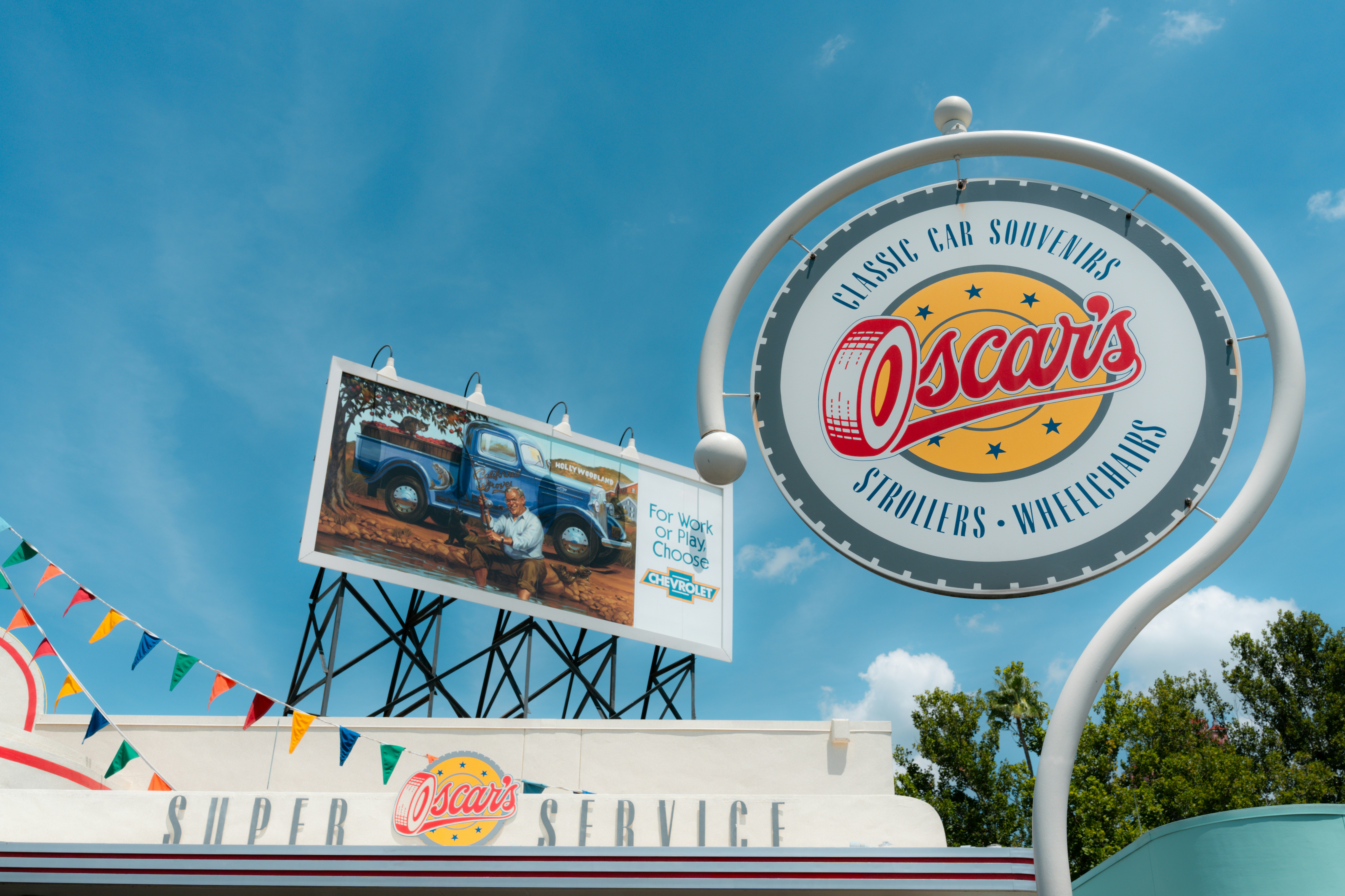 Neon Signage and Retro Billboard at Oscar's Classic Car Service