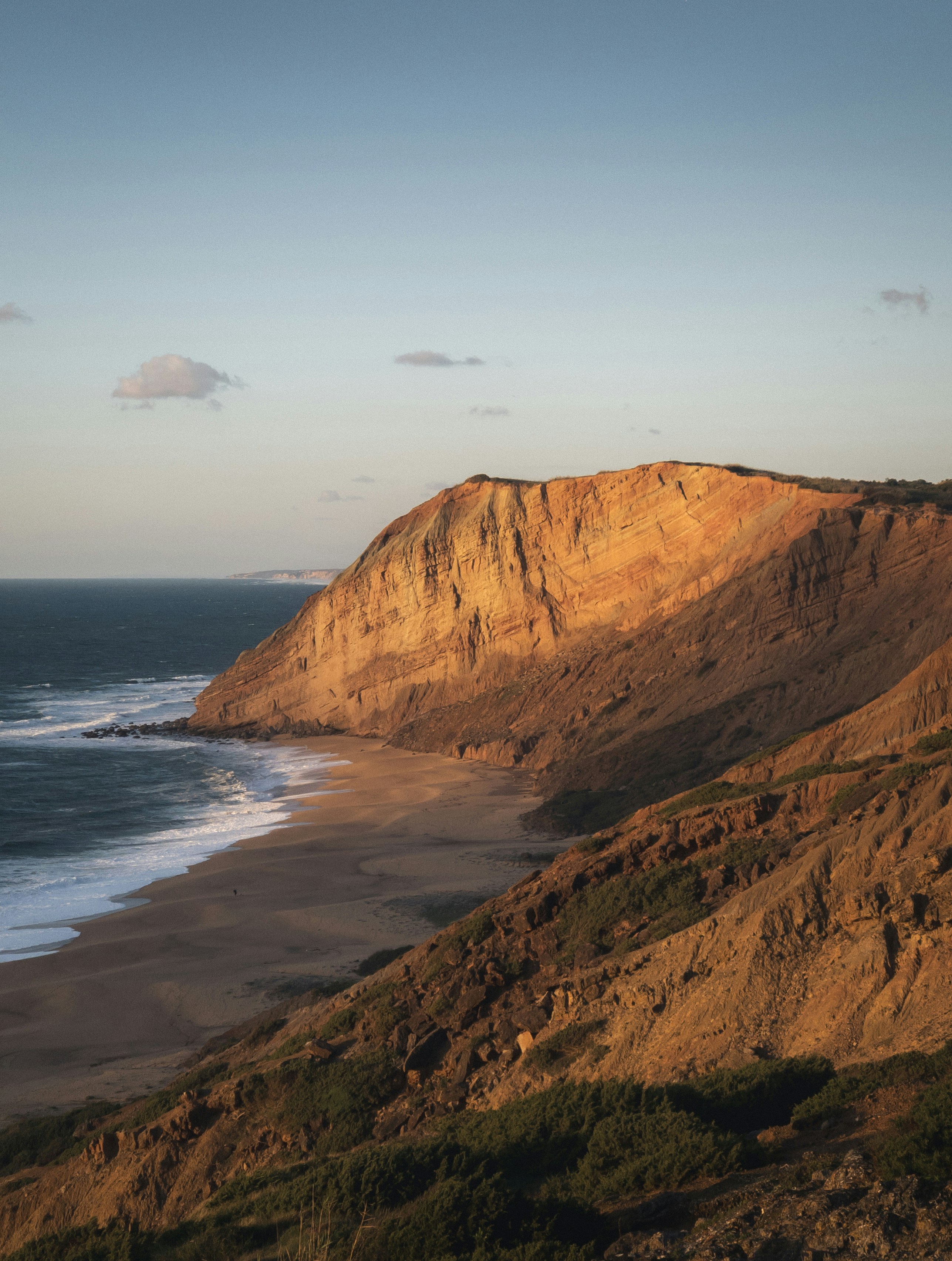 Cliffside beach basks in the golden light of sunset. photo – Free Beach ...