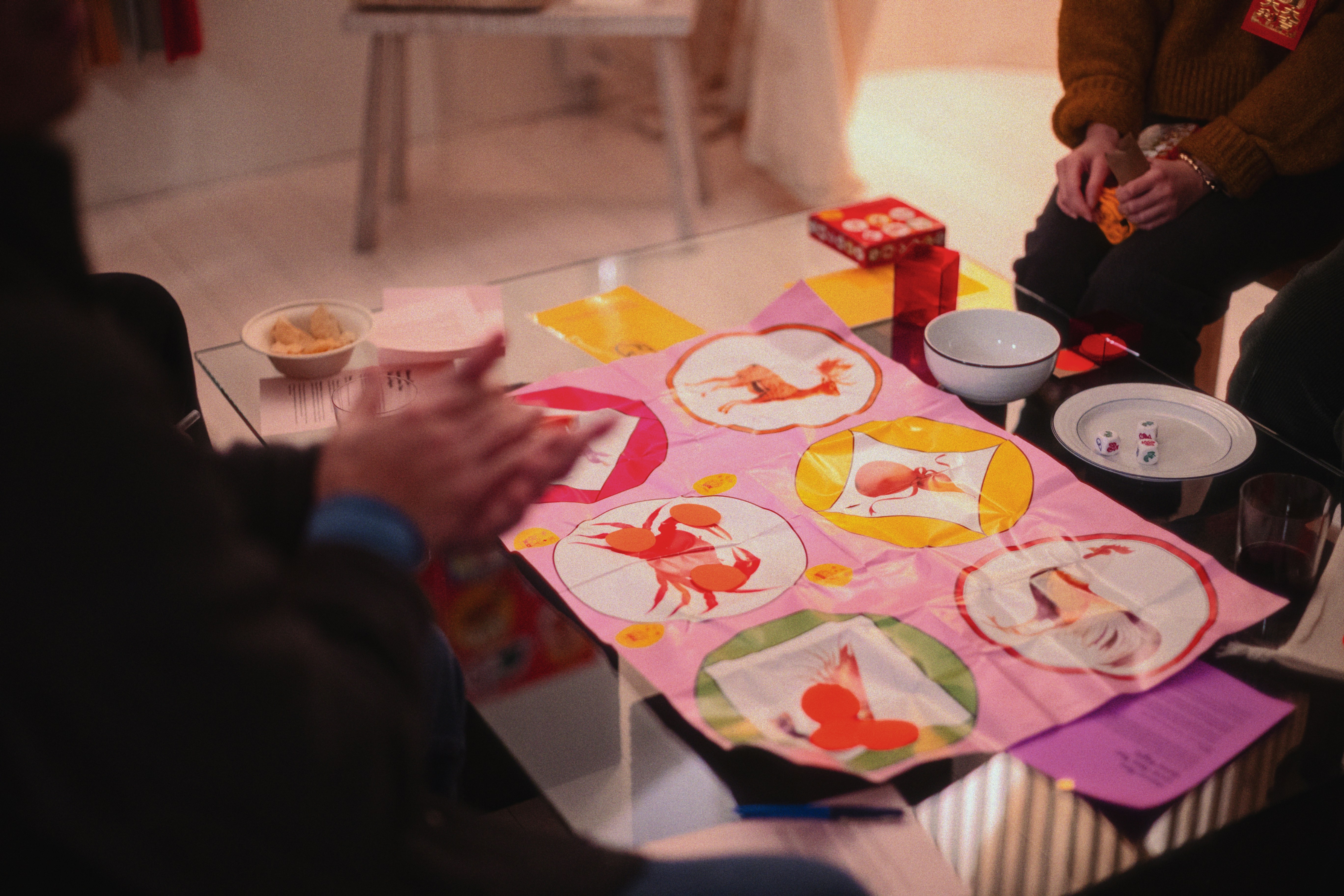 People are seated at a table playing a board game. photo – Free Food ...