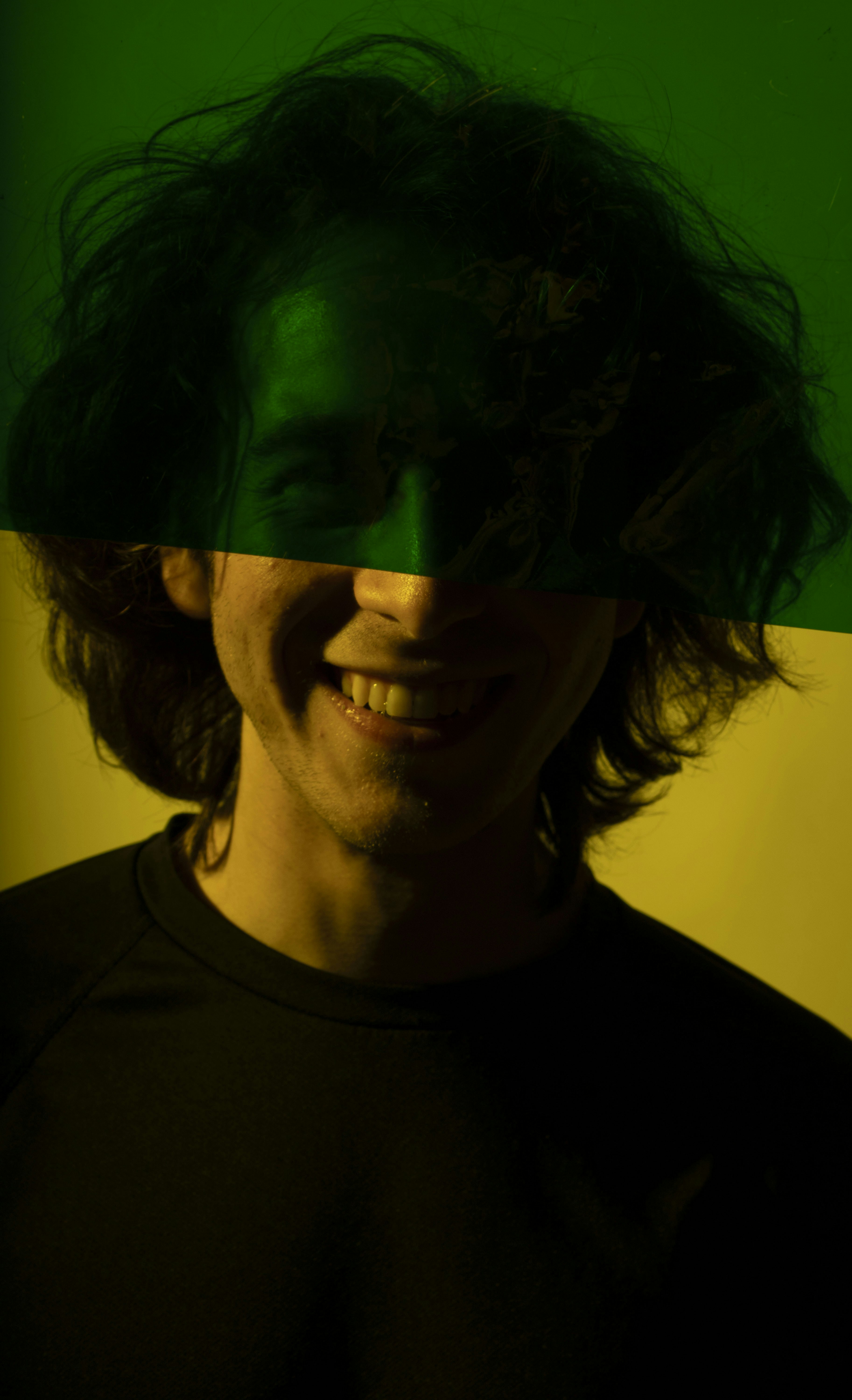 Green Band Across a Warm Portrait: A Smile Split by Color