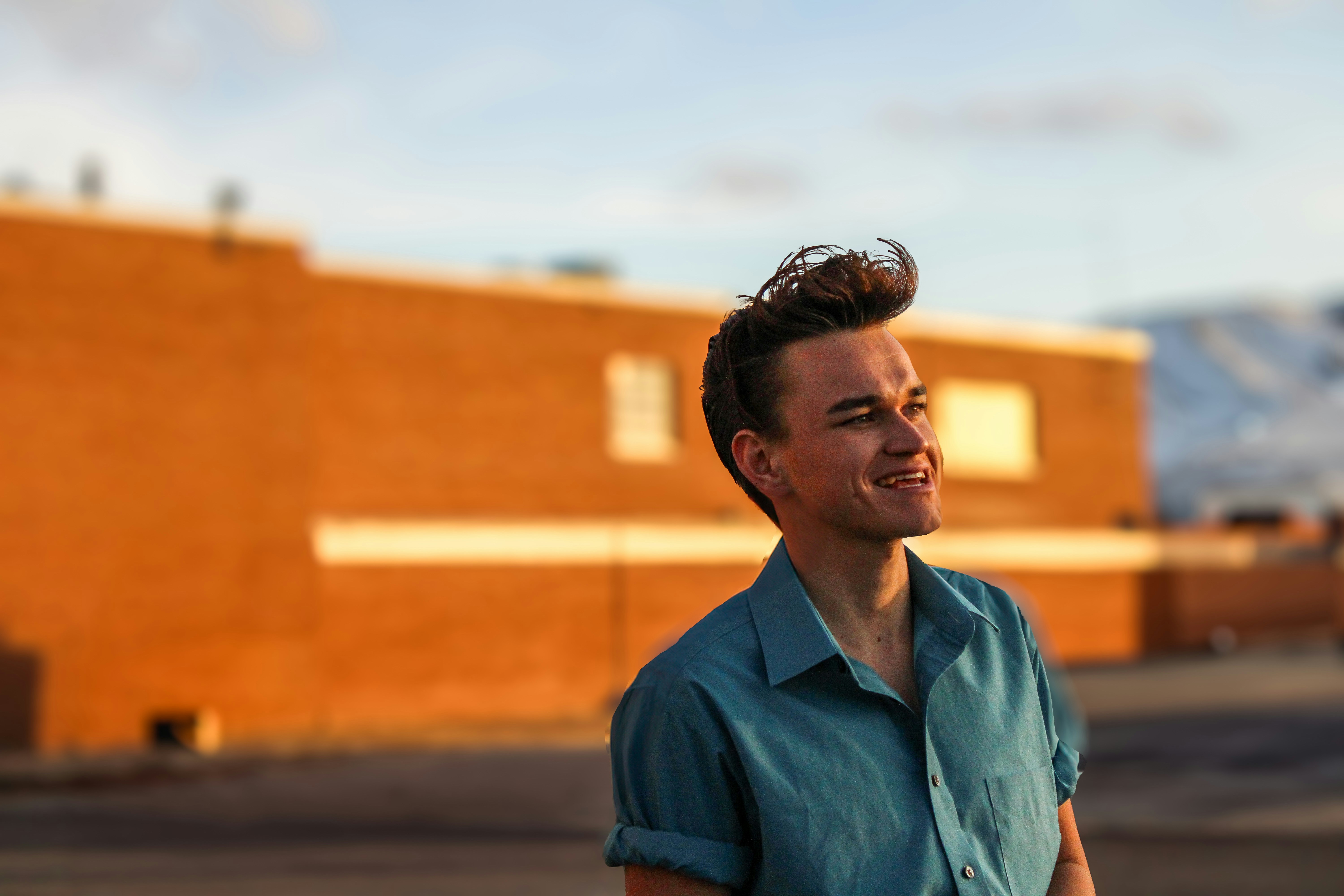 Man smiles, lit by golden hour sunlight. photo – Free Portrait Image on ...