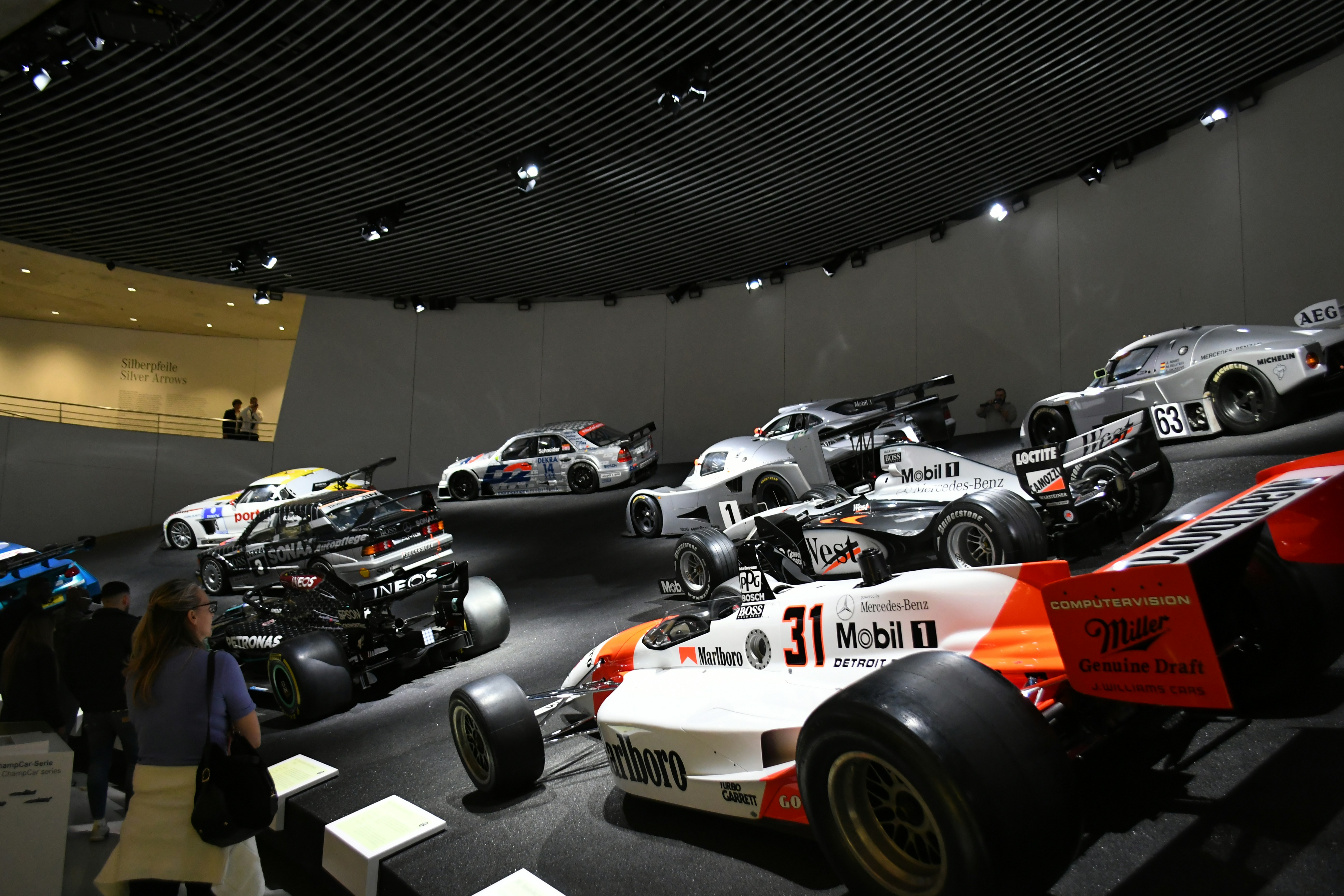 Race cars are displayed in a circular museum exhibit. photo – Free Car ...