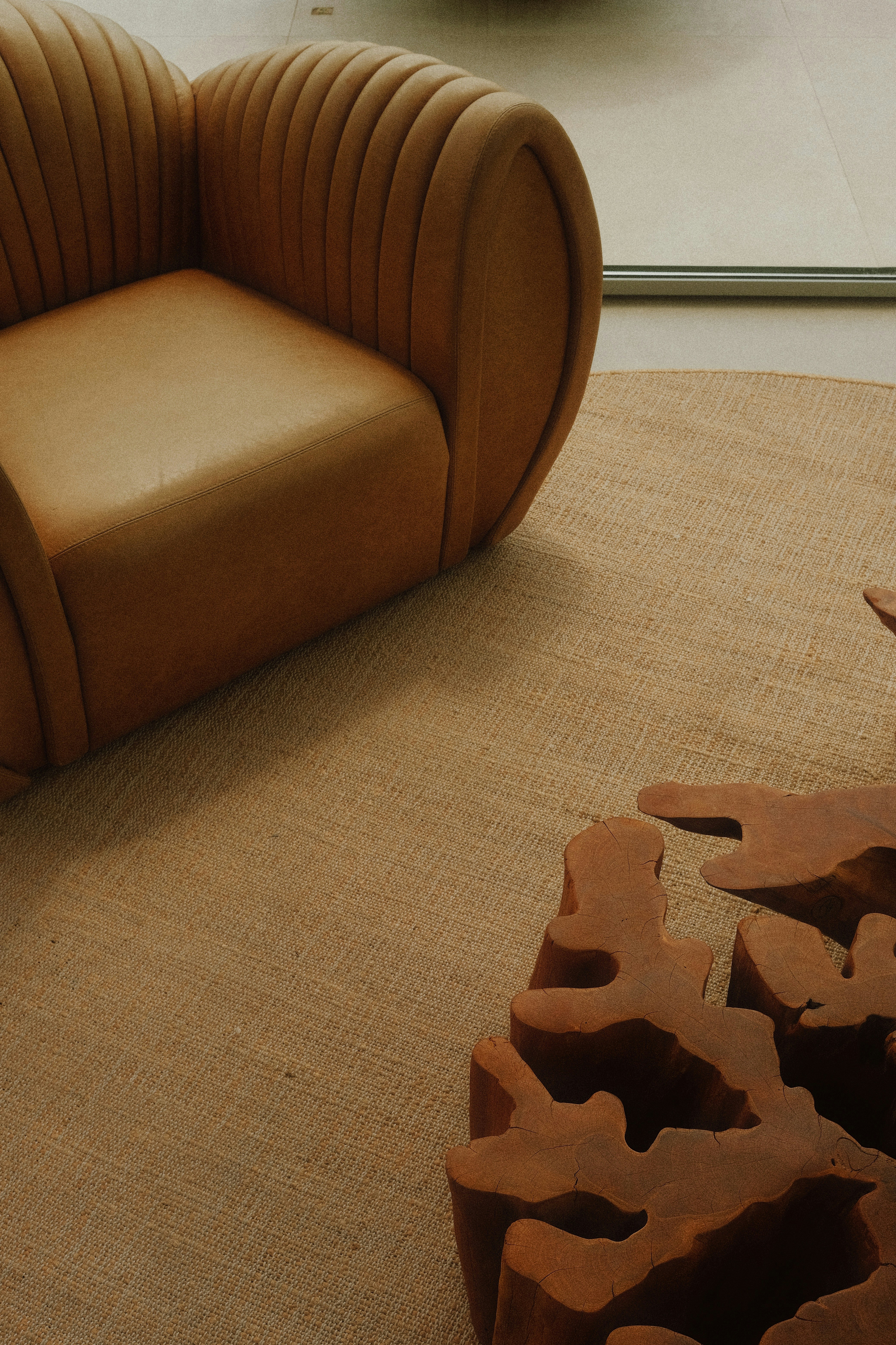 Cozy armchair rests on a textured rug. photo – Free Interior design ...