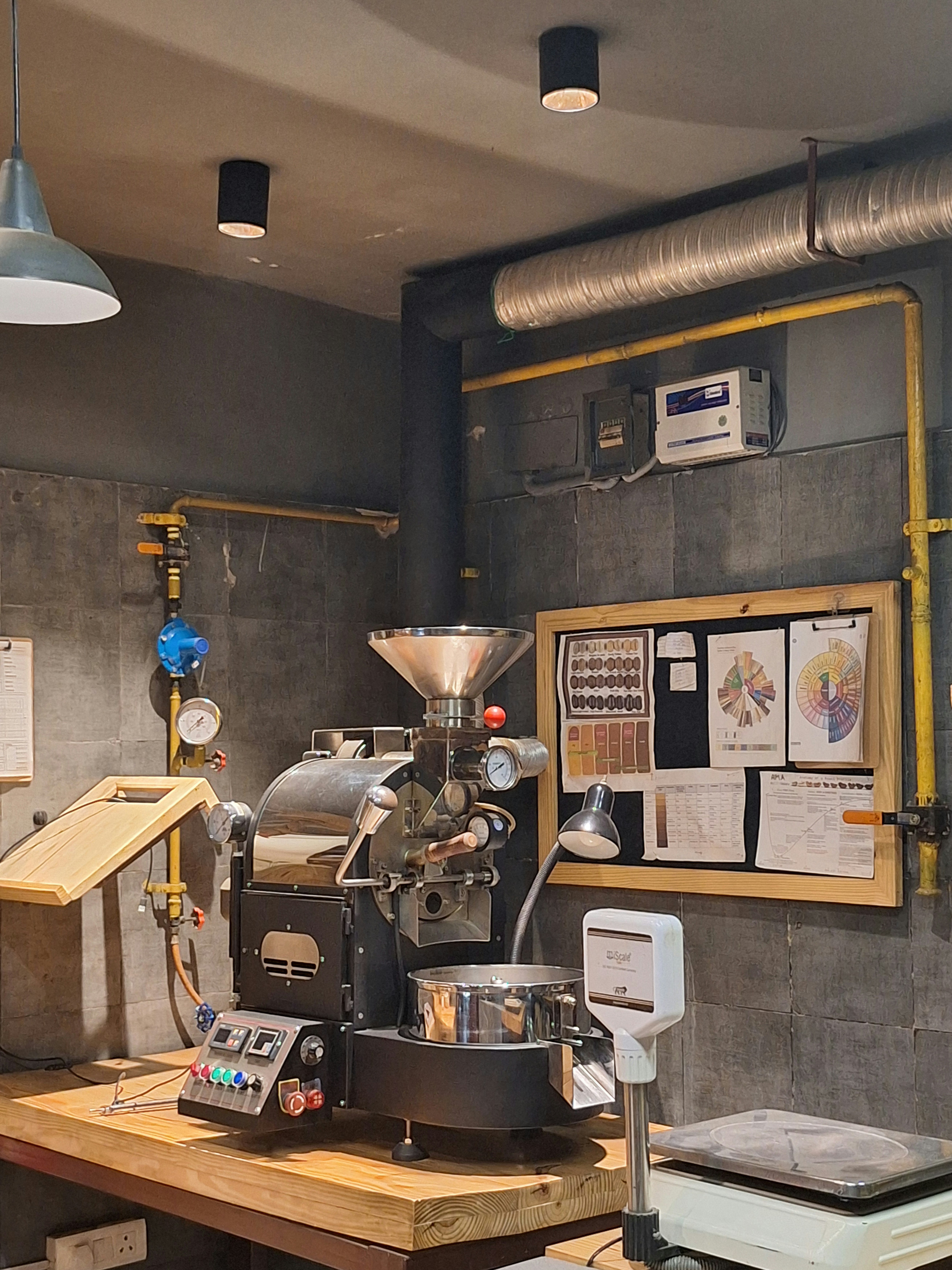 Coffee roasting equipment is set up indoors. photo – Free Full hd ...
