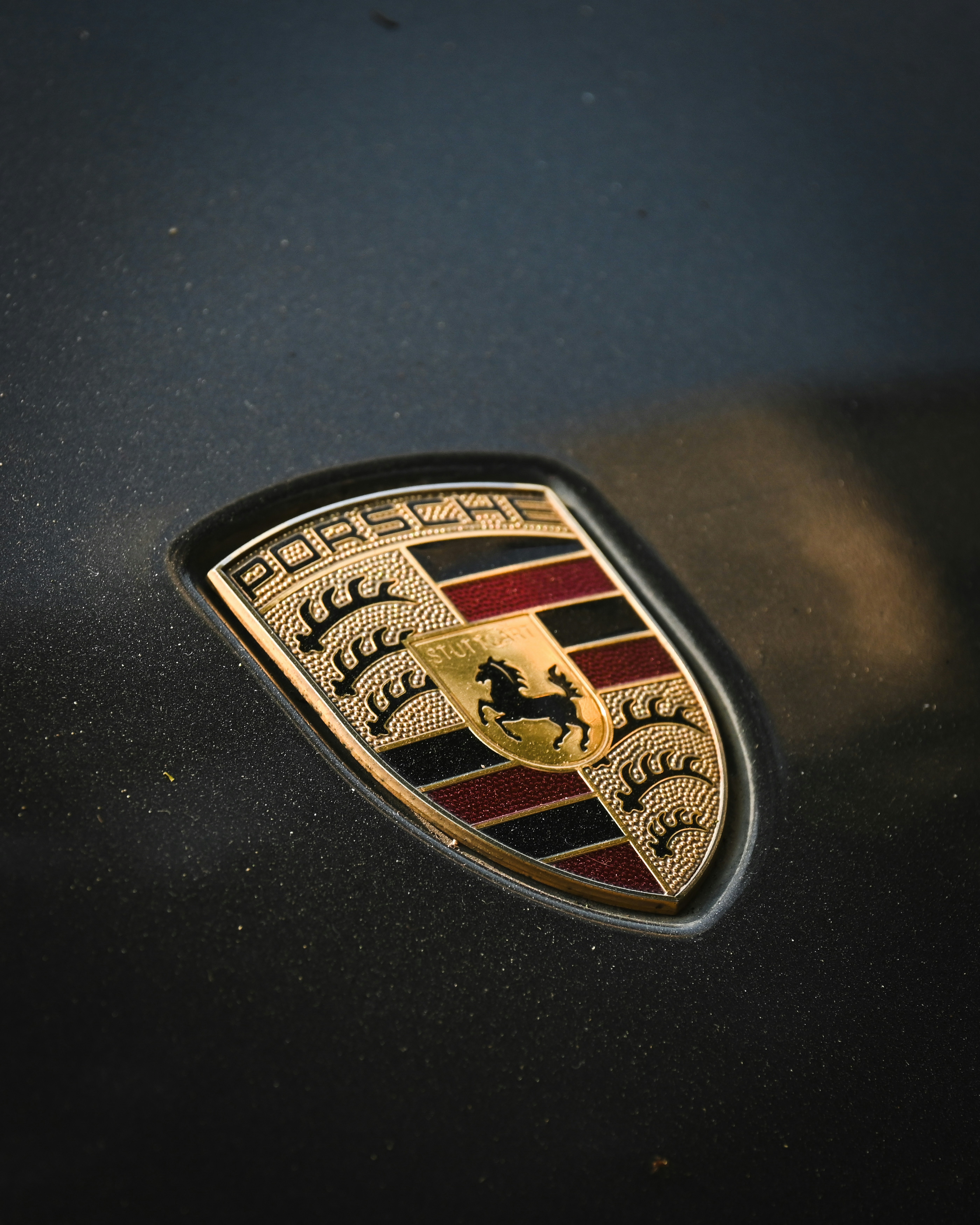 The porsche crest is visible on the vehicle. photo – Free Wallpaper ...