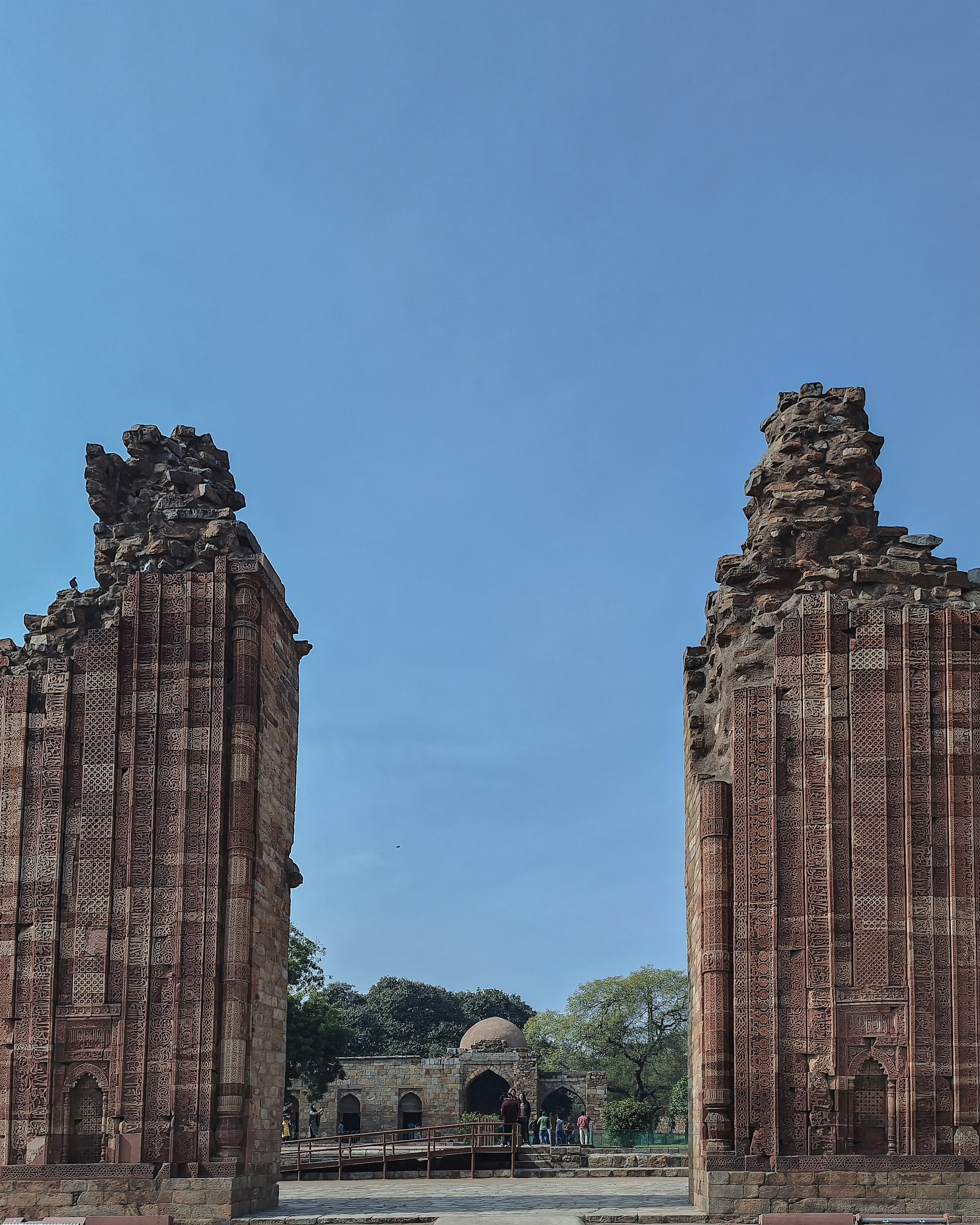 Threshold of Time: Archway Framed by Timeworn Pillars