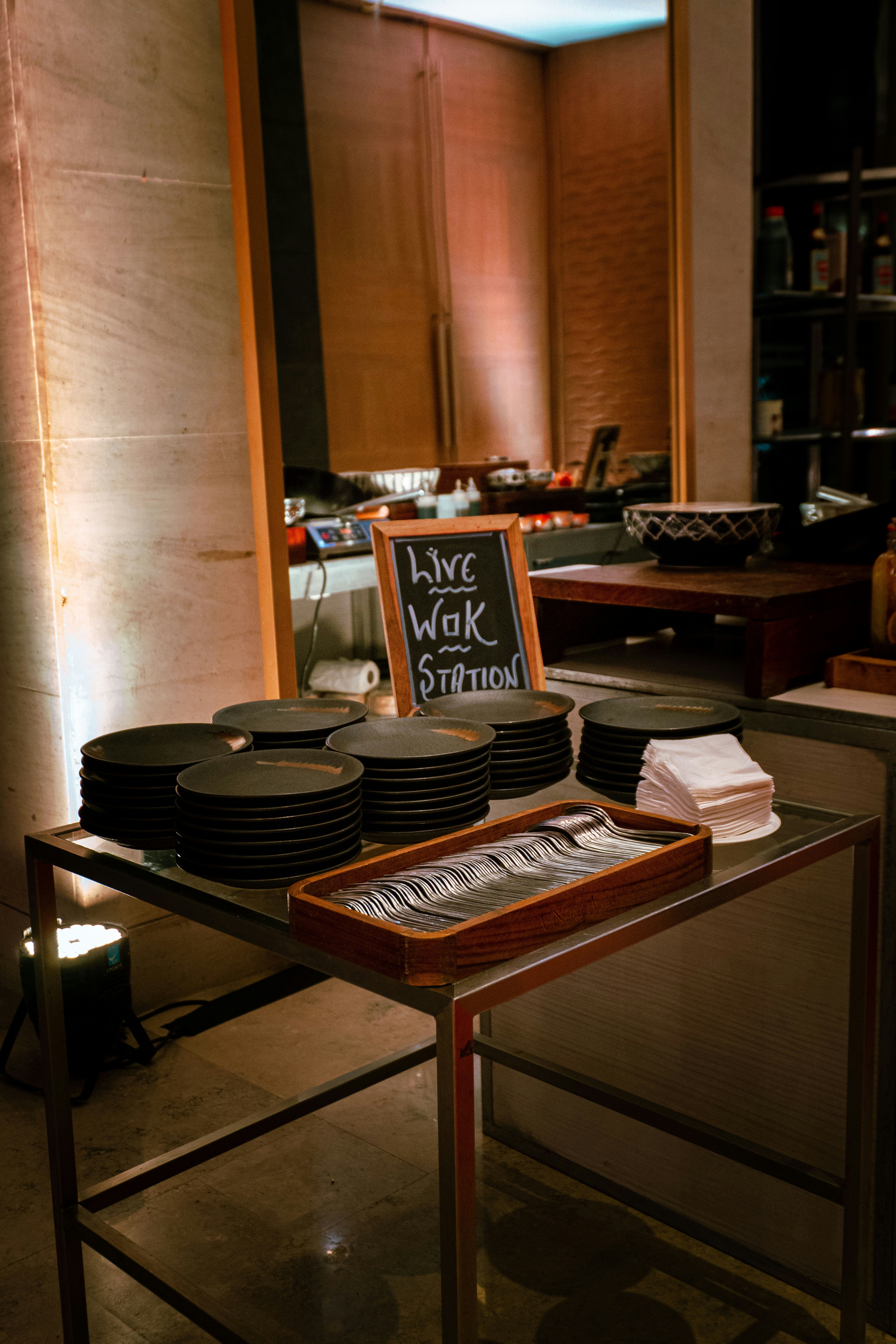 Stacks of Dishes and Chalkboard Sign in a Quiet Bistro