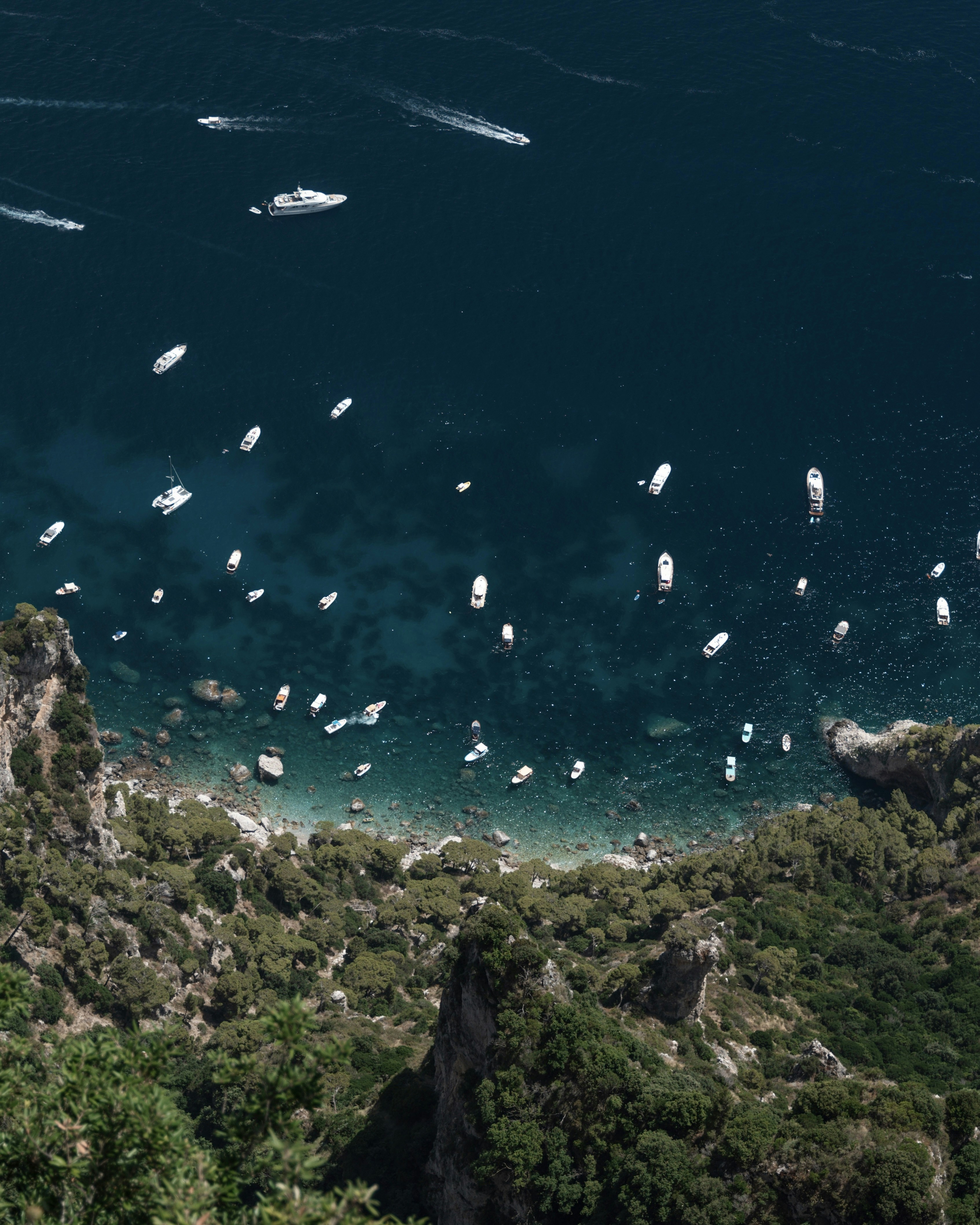Turquoise Bay, Aerial Mosaic: Boats Dot a Cliffside Cove