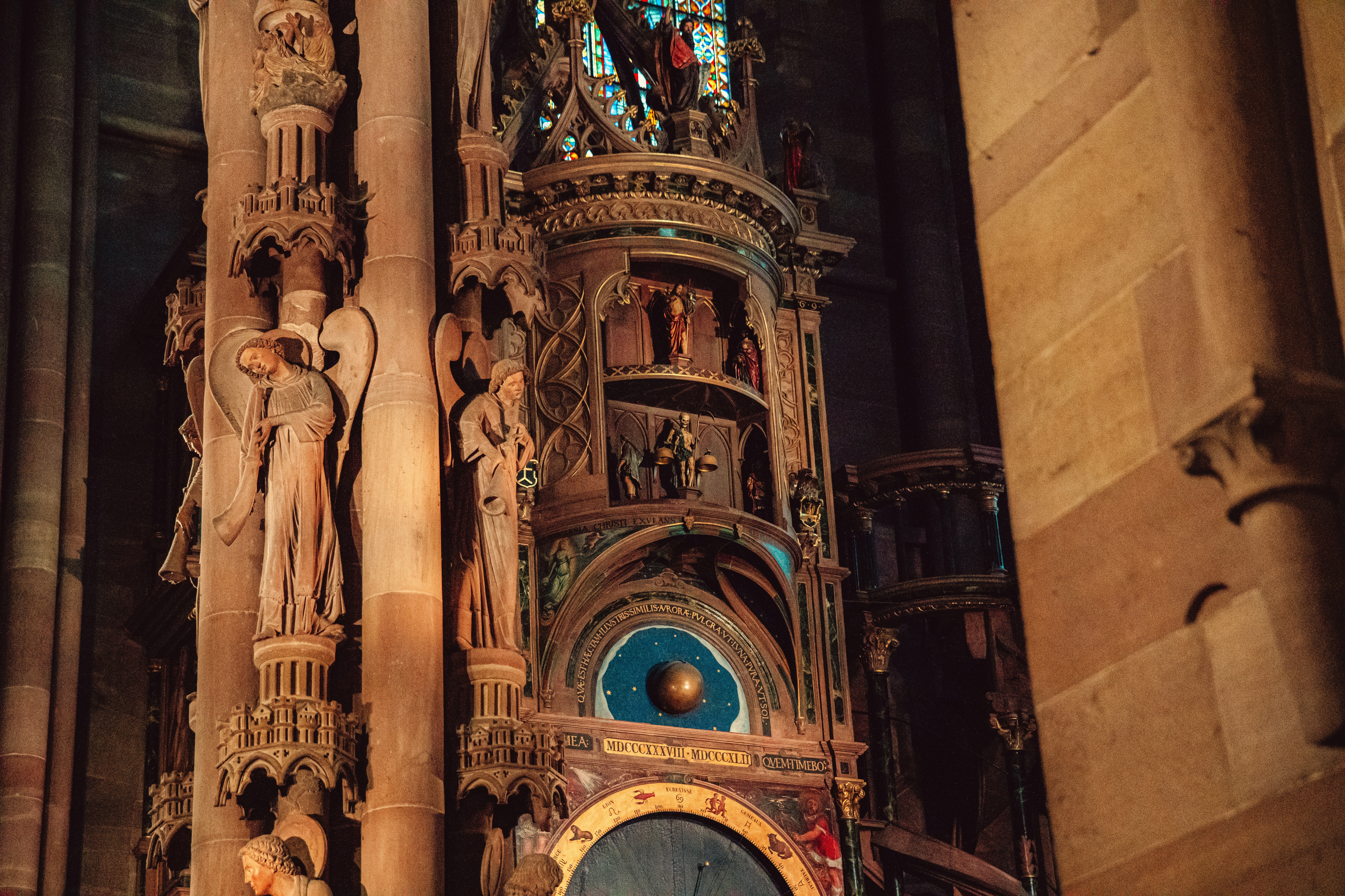 Blue Orb Among Gothic Carvings: A Moment in Amber Light